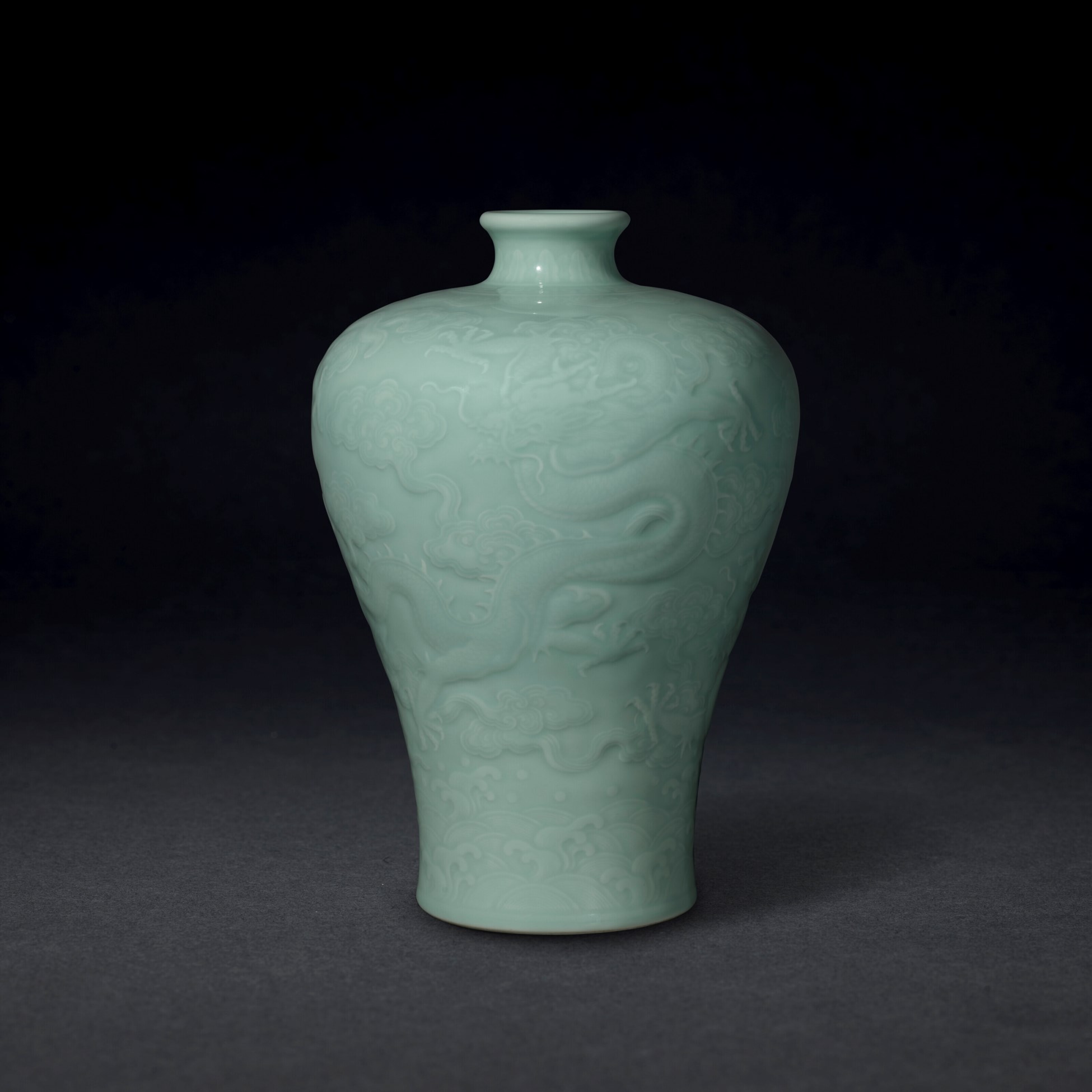 A FINE MAGNIFICENT CARVED ‘DRAGON’ CELADON-GLAZED MEIPING, QIANLONG SIX ...