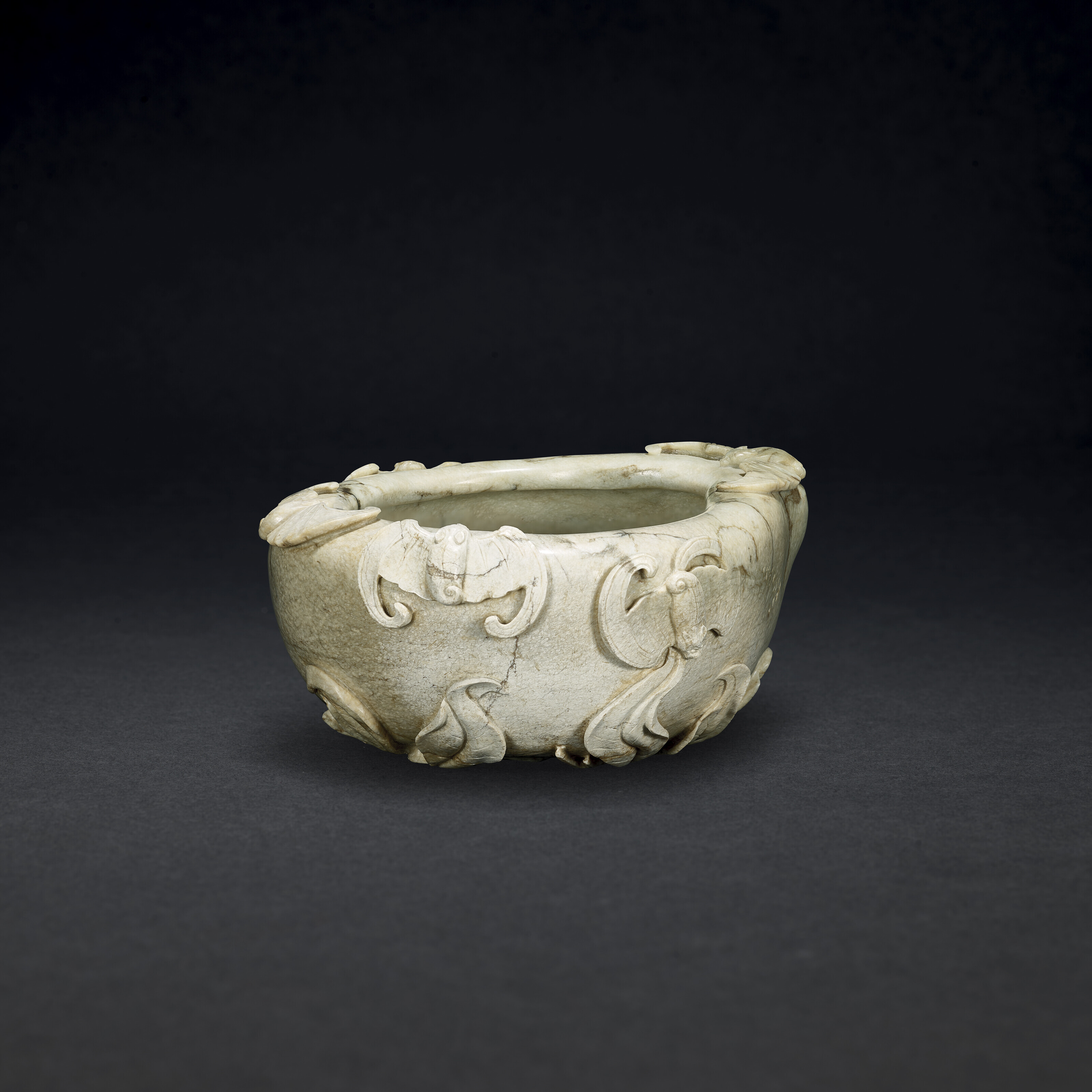 A JADE AND HARDSTONE EMBELLISHED REPOUSSE GILT-METAL MIRROR, SQUARE ...