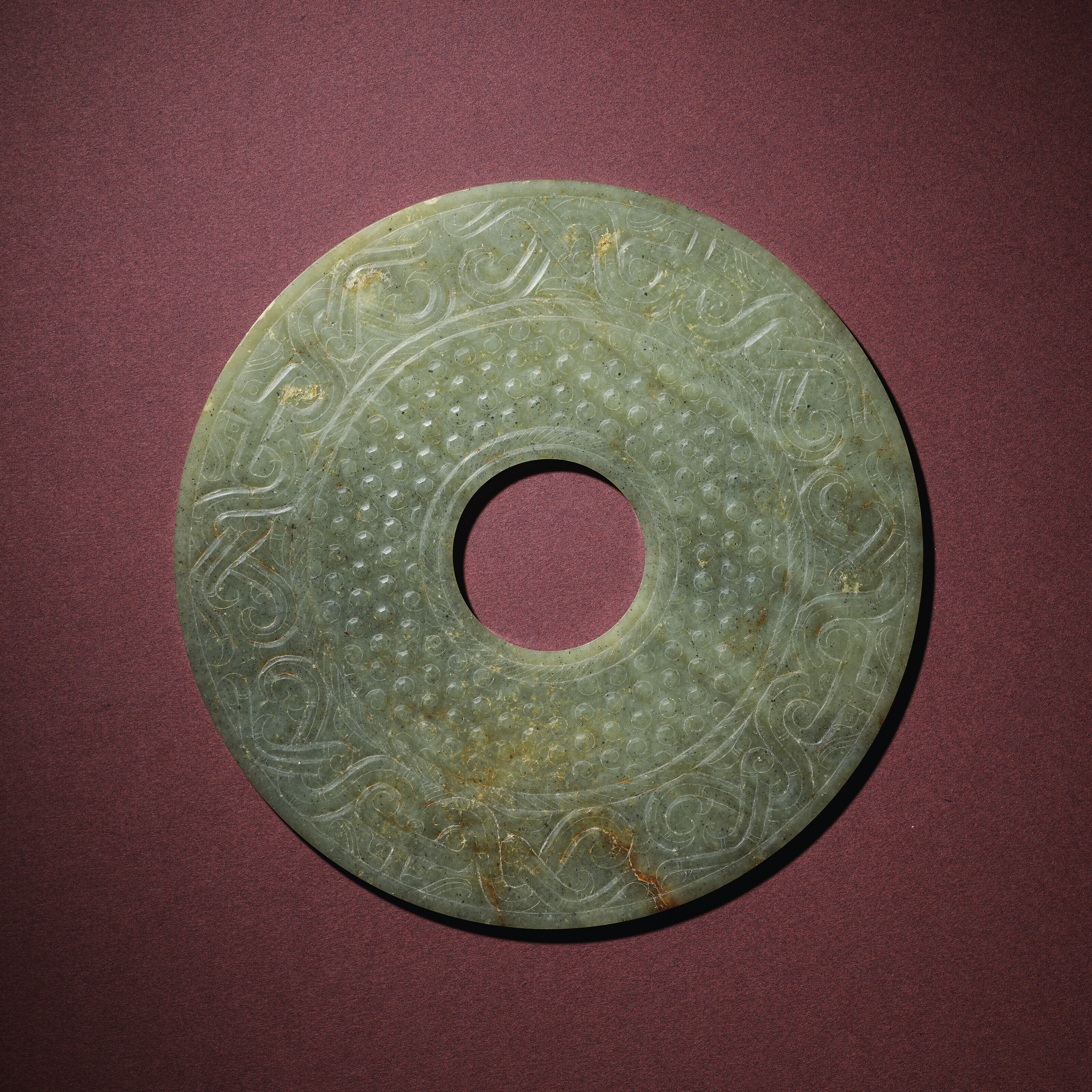 A LARGE WHITE JADE RETICULATED ‘PHOENIX’ PLAQUE, LATE WESTERN HAN ...