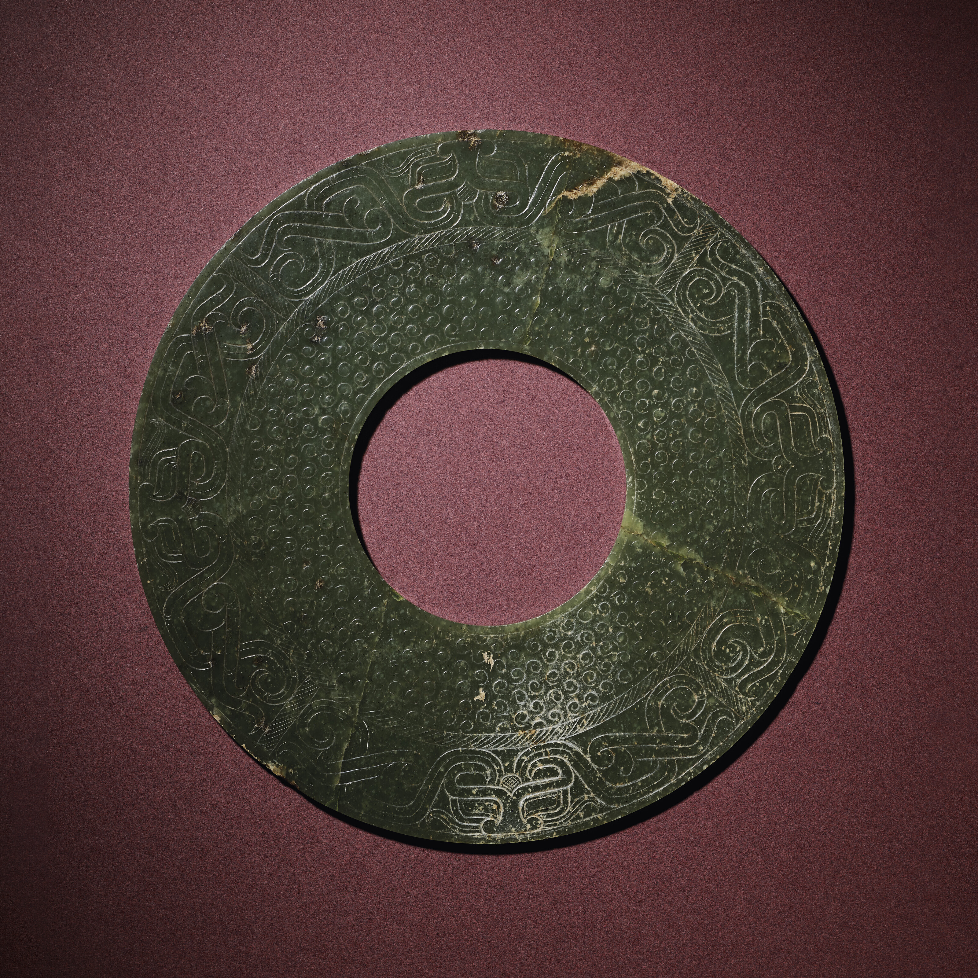 A LARGE WHITE JADE RETICULATED ‘PHOENIX’ PLAQUE, LATE WESTERN HAN ...