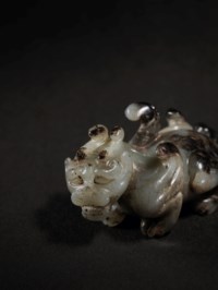 AN EXCEEDINGLY RARE AND EXCEPTIONAL JADE CARVING OF A MYTHICAL BEAST ...