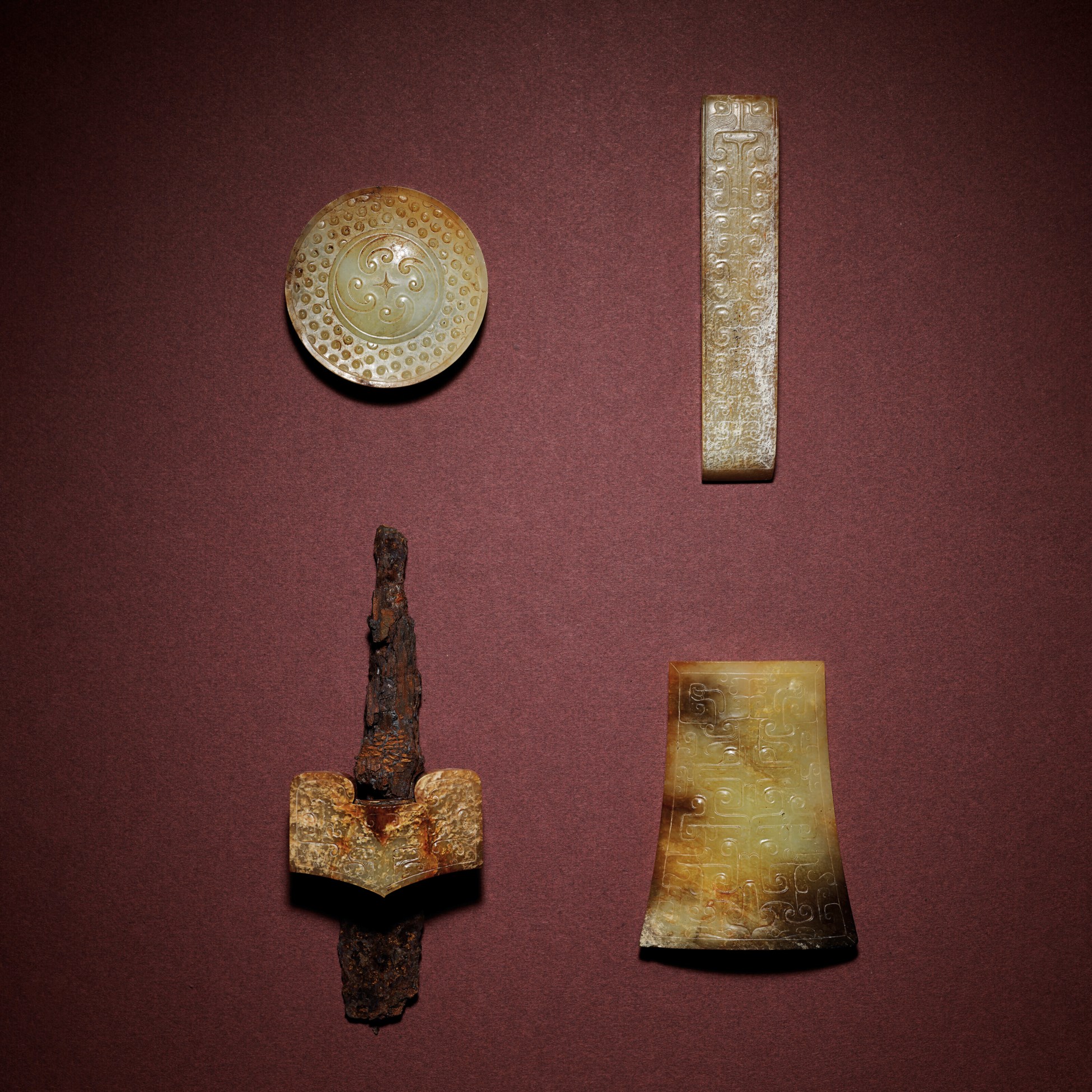 A VERY RARE COMPLETE SET OF FOUR JADE SWORD FITTINGS, WESTERN HAN ...