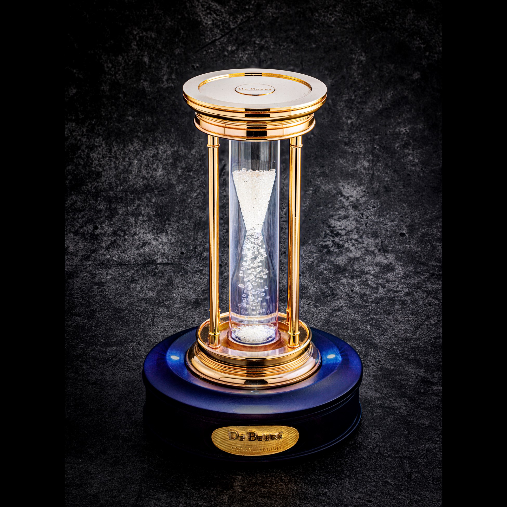 DE BEERS. A BRASS AND DIAMOND HOUR GLASS TIMER | Christie's