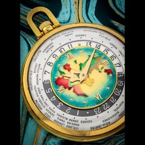 PATEK PHILIPPE. A MAGNIFICENT AND EXTREMELY RARE 18K GOLD WORLD TIME ...