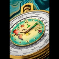 PATEK PHILIPPE. A MAGNIFICENT AND EXTREMELY RARE 18K GOLD WORLD TIME ...