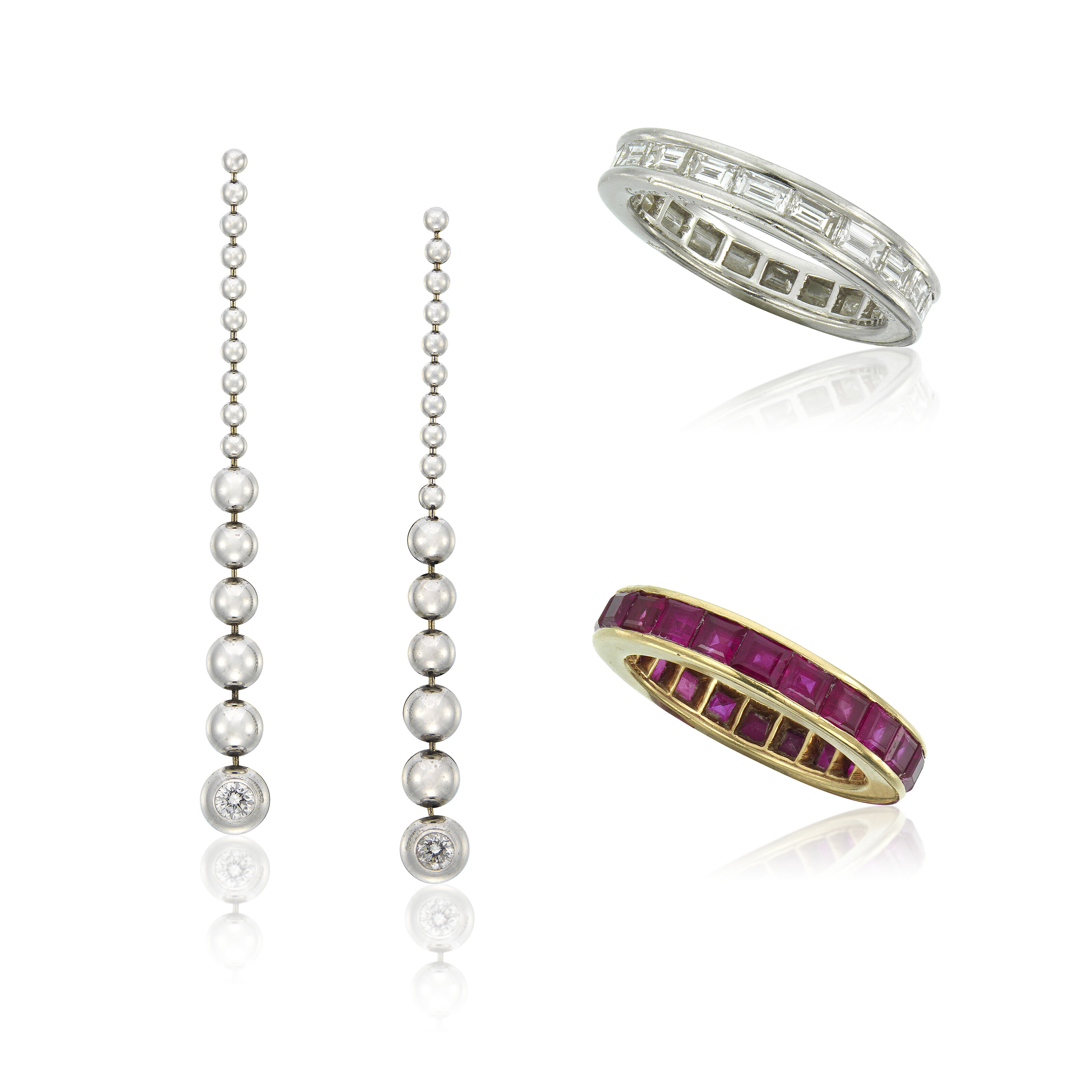 CARTIER DIAMOND AND RUBY ETERNITY RINGS; TOGETHER WITH DIAMOND EARRINGS ...
