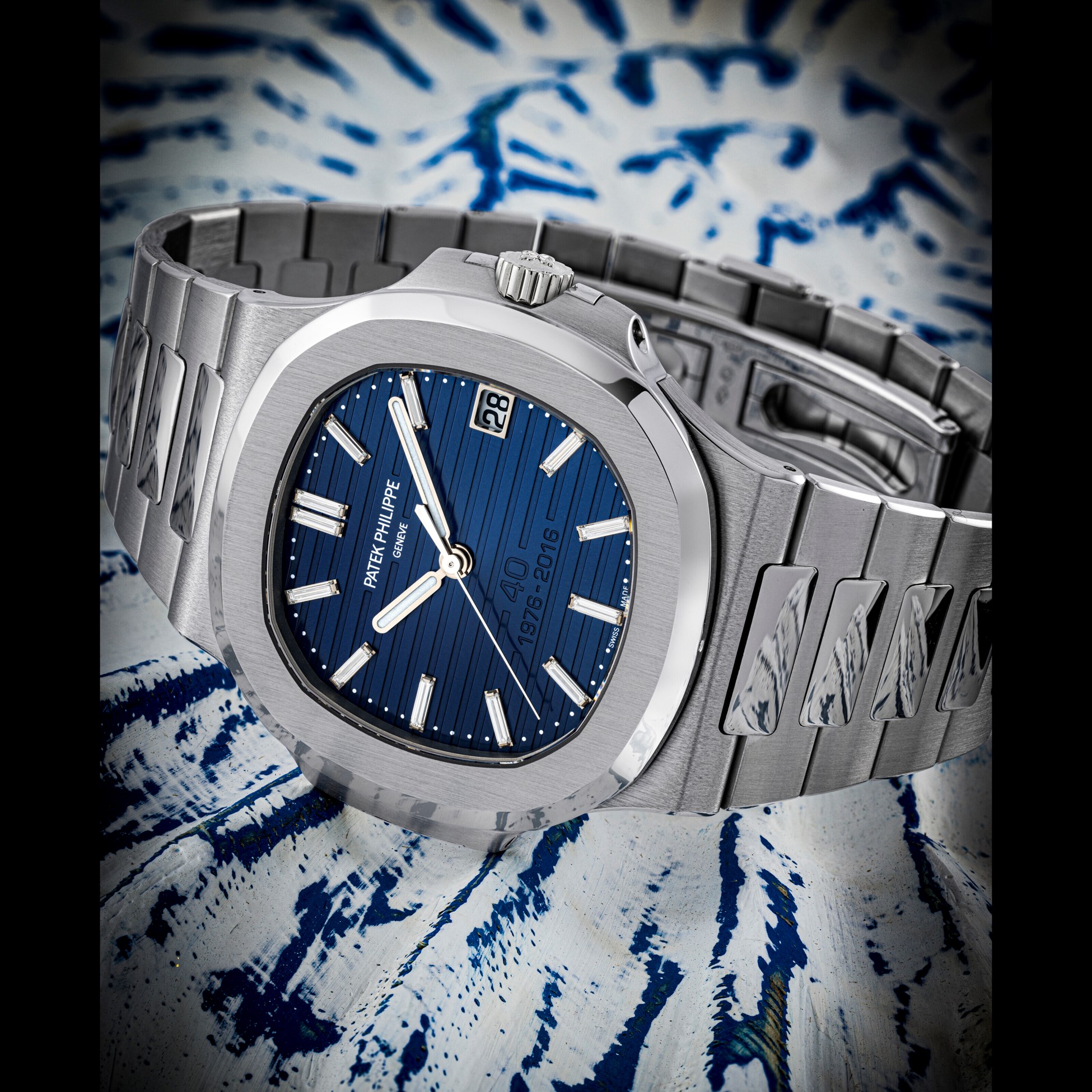 PATEK PHILIPPE. A RARE PLATINUM AND BAGUETTE-CUT DIAMOND-SET LIMITED ...