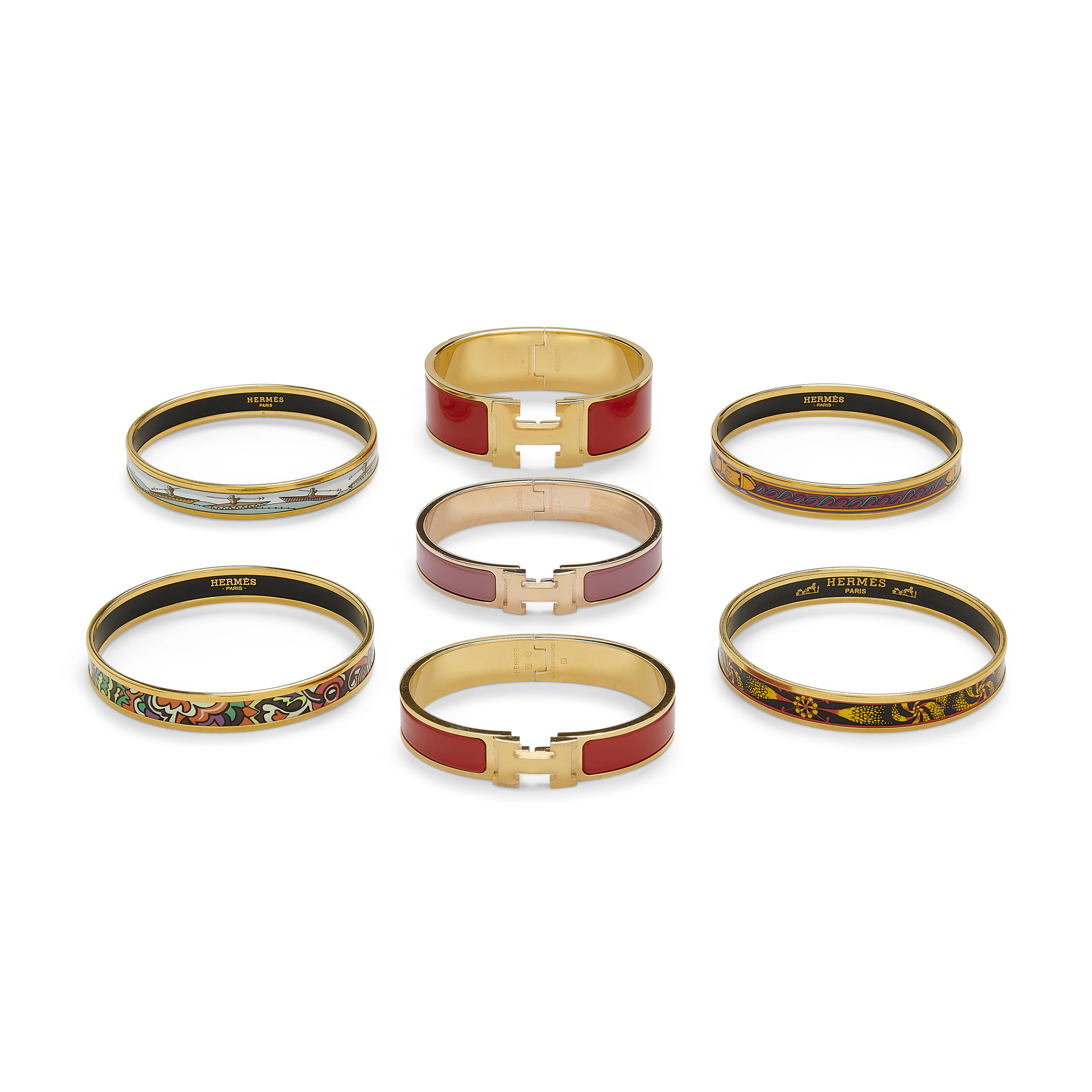A SET OF SEVEN: A GOLD ROUGE ENAMEL CLIC-CLAC MM, A GOLD ROUGE ENAMEL ...