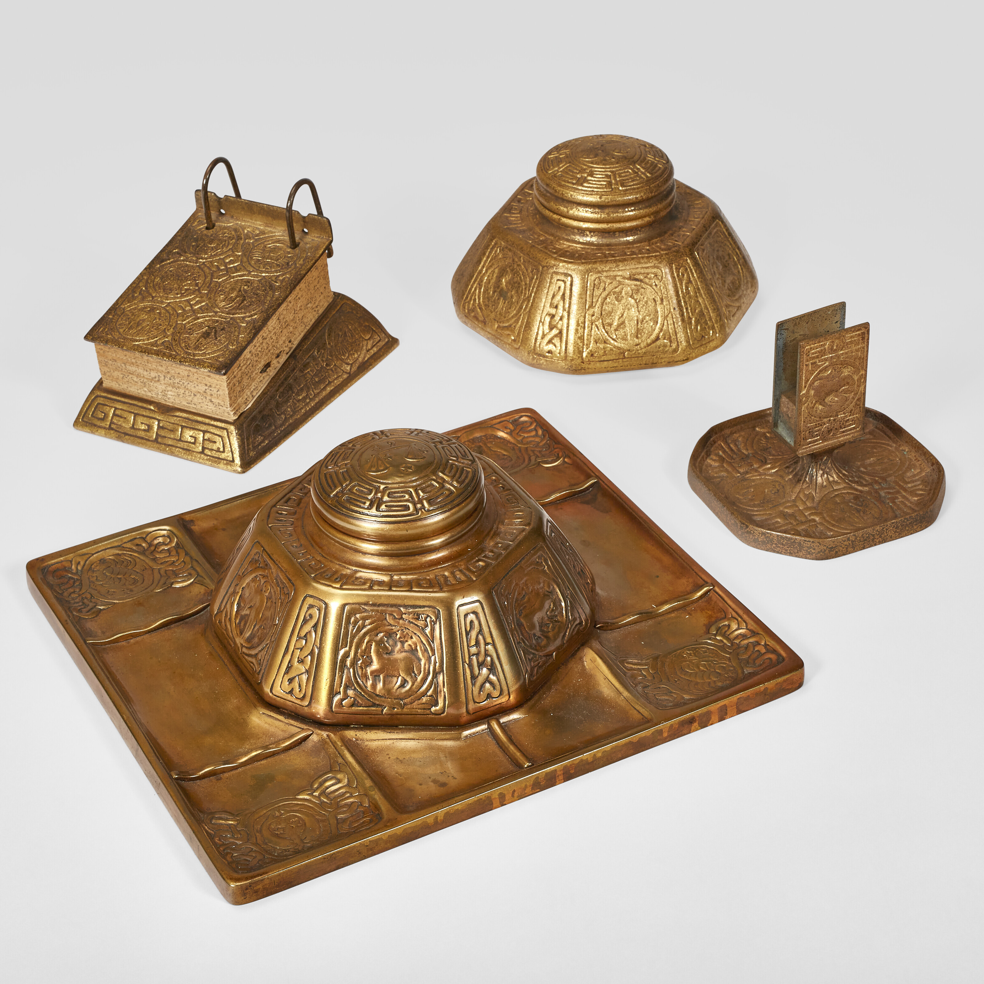 TIFFANY STUDIOS, Four-Piece 'Zodiac' Desk Set, circa 1915 | Christie’s