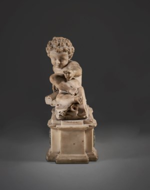 AN ALLEGORAL MARBLE FIGURE OF A PUTTO REPRESENTING THE ARTS