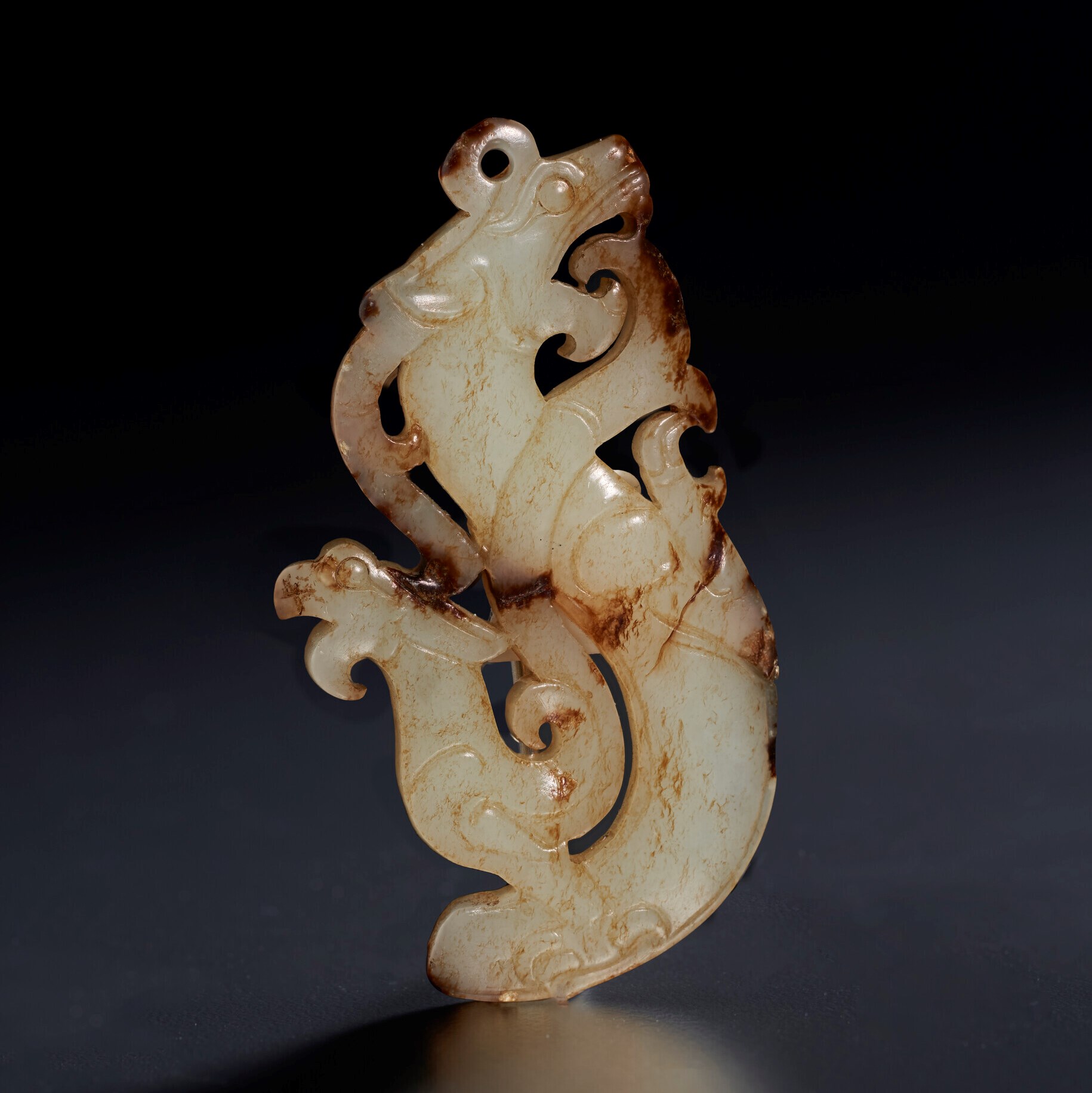 A PALE GREYISH-WHITE JADE ‘DRAGON AND PHOENIX’ PENDANT, WESTERN HAN ...