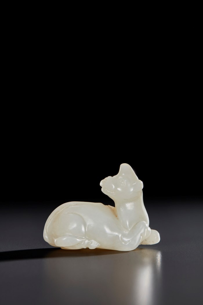 A SMALL PALE GREENISH-WHITE JADE FIGURE OF A HORNED BEAST, SONG-MING ...