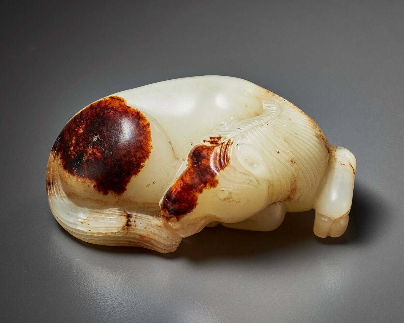 A WHITE AND RUSSET JADE HORSE, 17TH-18TH CENTURY | Christie's