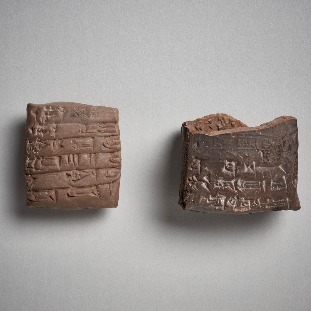 A SUMERIAN CLAY CUNEIFORM TABLET AND FRAGMENTARY ENVELOPE, UMMA, THIRD ...