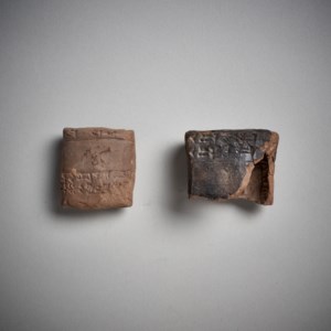 A SUMERIAN CLAY CUNEIFORM TABLET AND FRAGMENTARY ENVELOPE, UMMA, THIRD ...