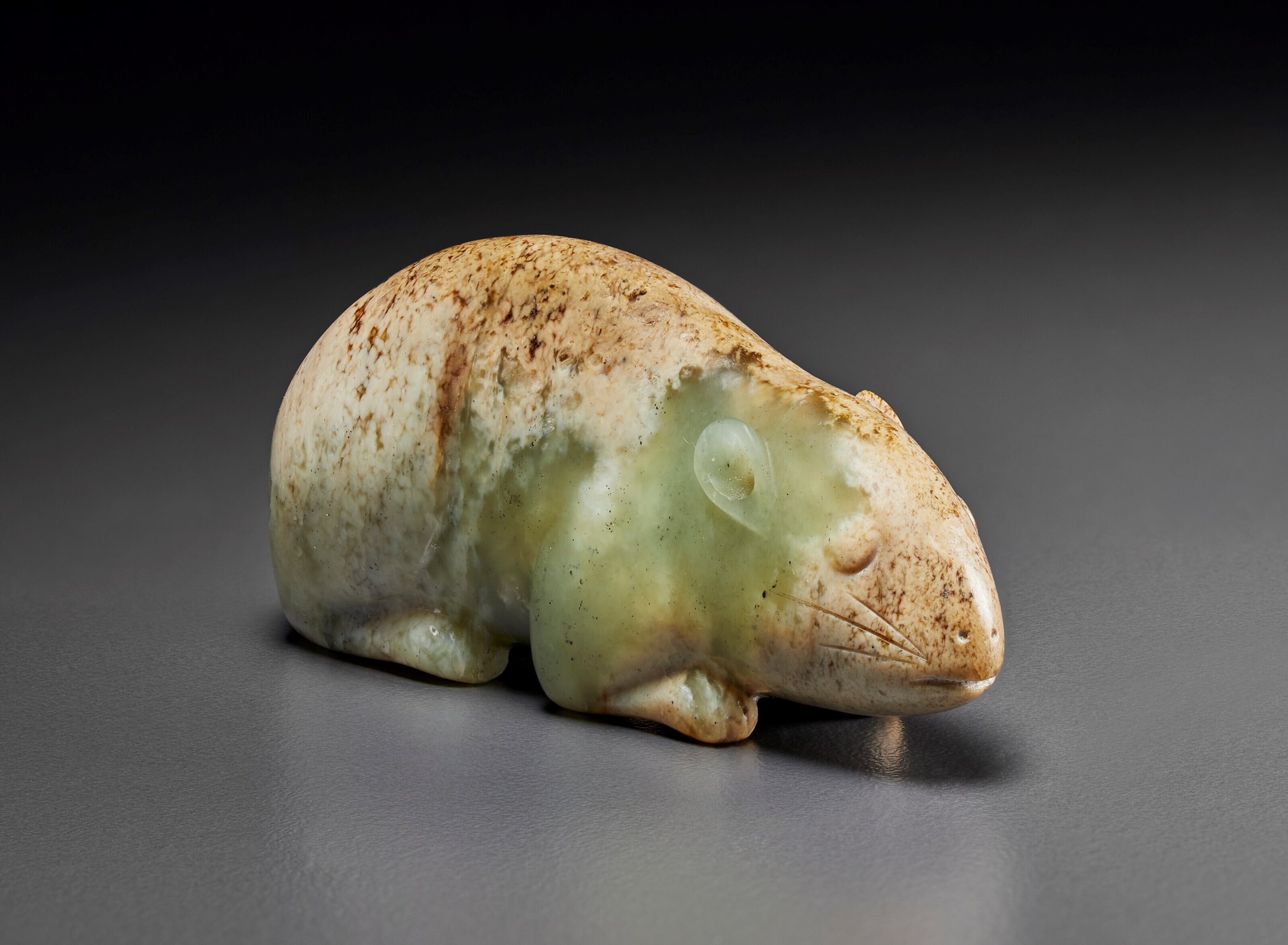 A RARE CELADON AND BUFF JADE FIGURE OF A RAT, MING DYNASTY (1368-1644 ...