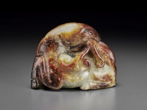 A MOTTLED RUSSET AND GREY JADE FIGURE OF A RAM, MING DYNASTY (1368-1644 ...