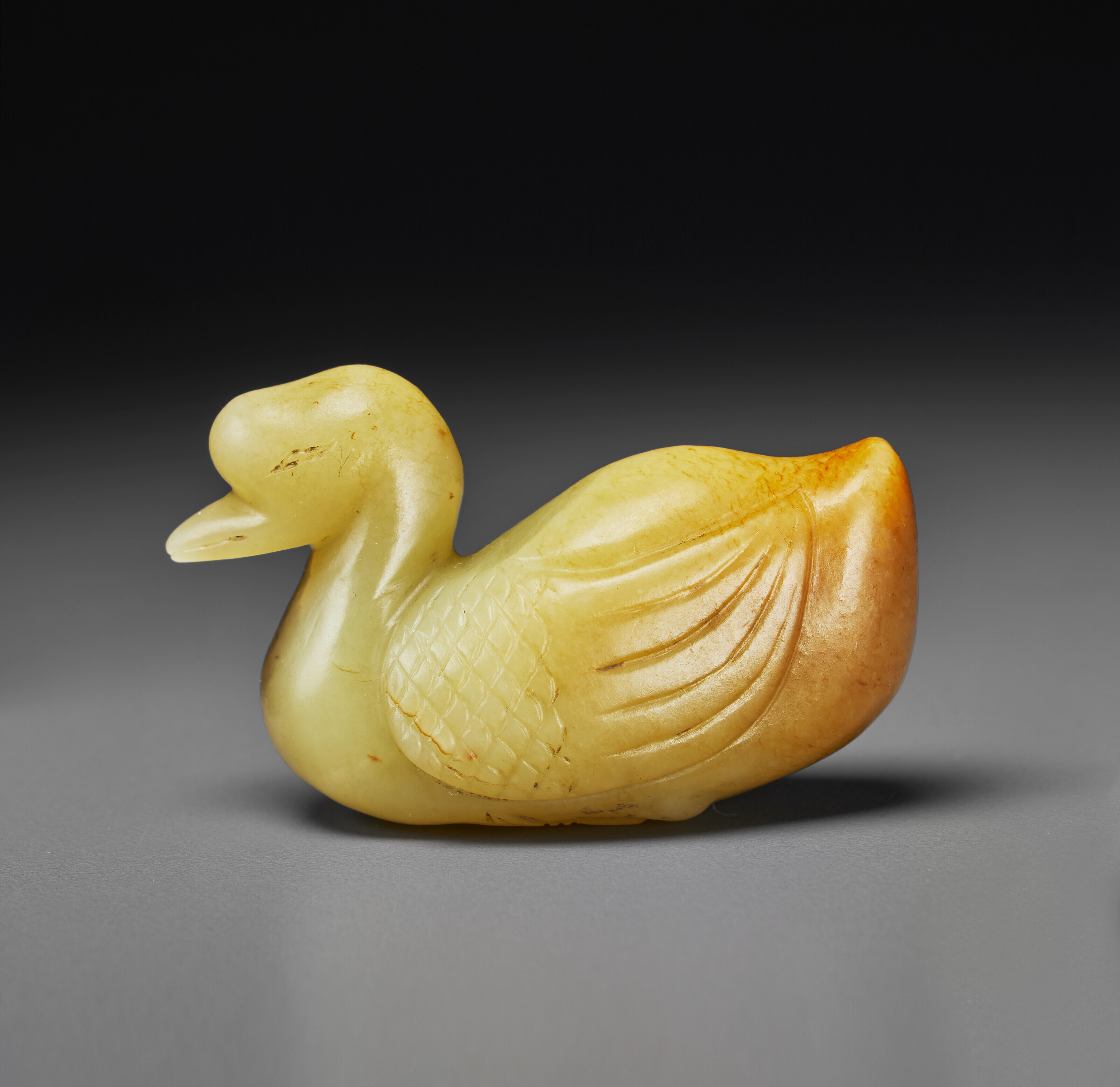 A RARE CELADON AND BUFF JADE FIGURE OF A RAT, MING DYNASTY (1368-1644 ...