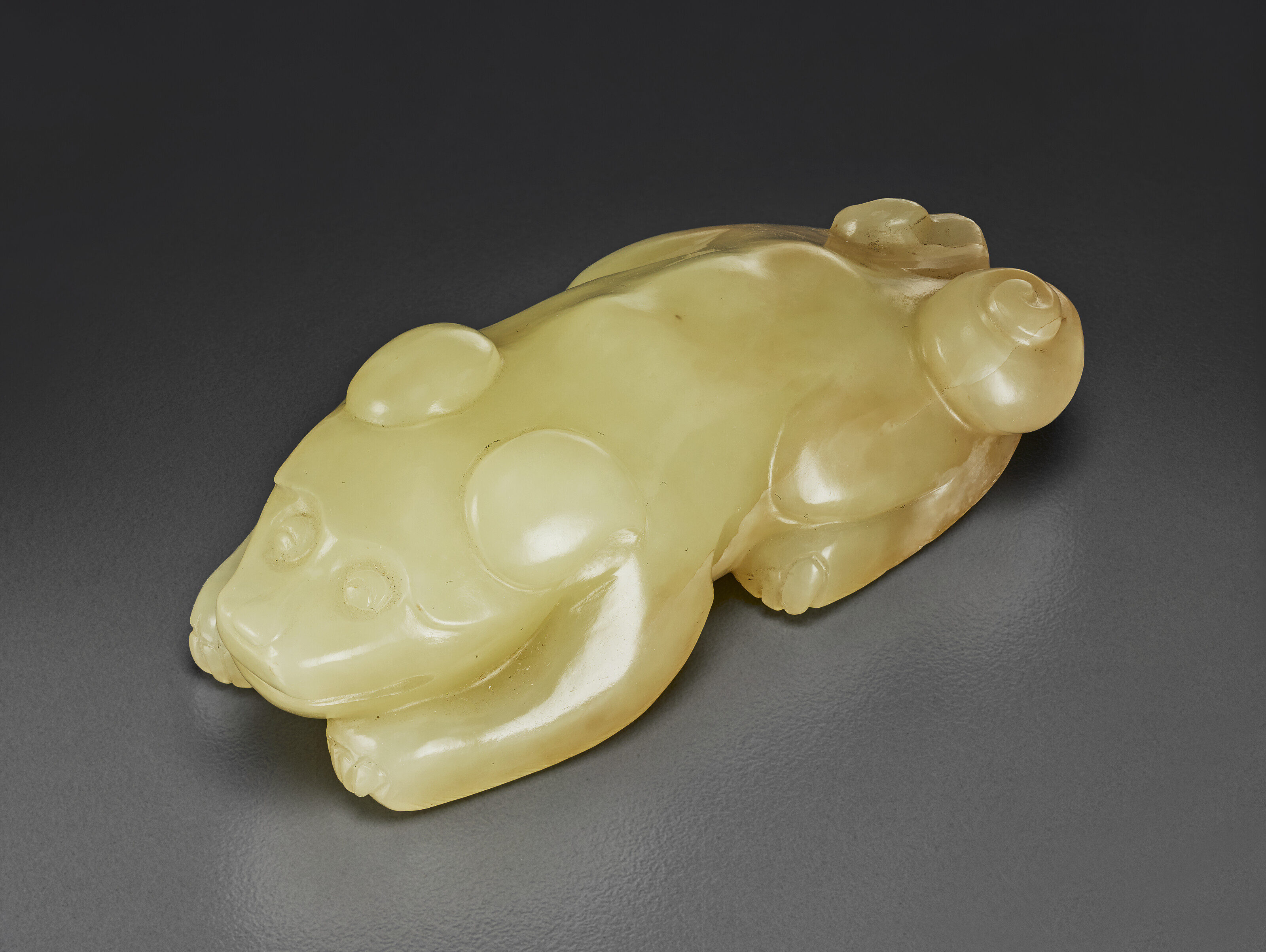 A PALE GREY AND RUSSET JADE RHYTON, GONG, QING DYNASTY, 17TH-18TH ...