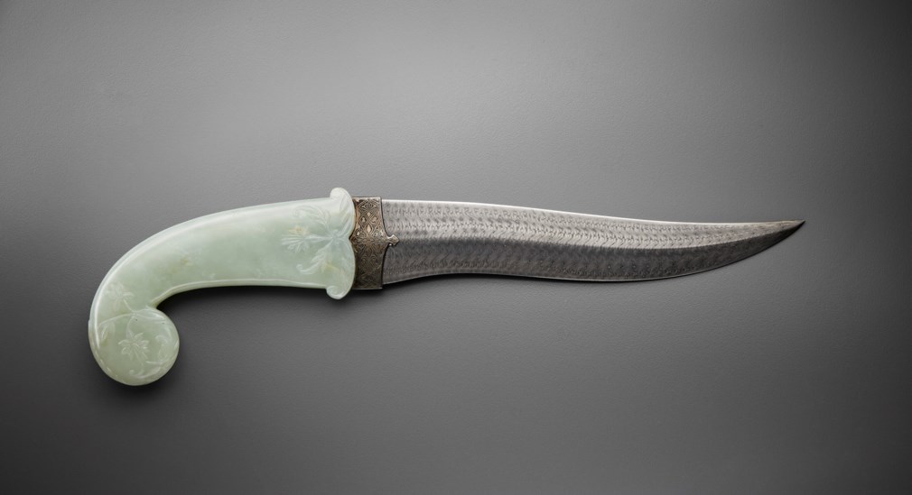 A MUGHAL CARVED GREENISH-WHITE JADE DAGGER HANDLE, THE JADE HANDLE, LATE MUGHAL, 18TH CENTURY ...