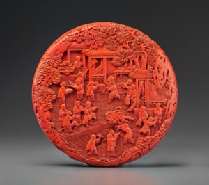A RARE AND FINELY CARVED RED LACQUER `HUNDRED BOYS’ CIRCULAR BOX AND ...