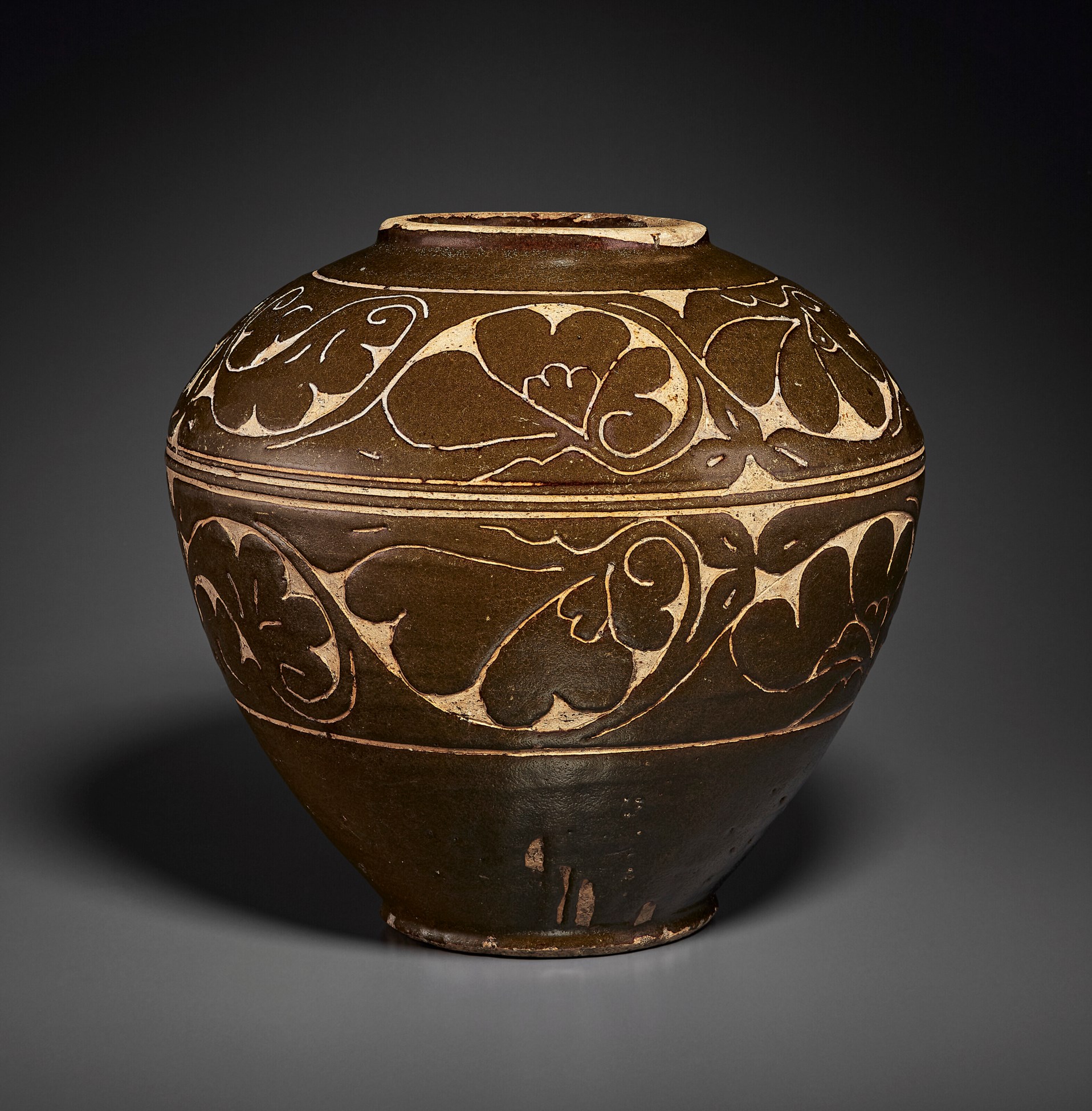 A CARVED CIZHOU BLACK-GLAZED JAR, JIN-YUAN DYNASTY, 13TH-14TH CENTURY ...