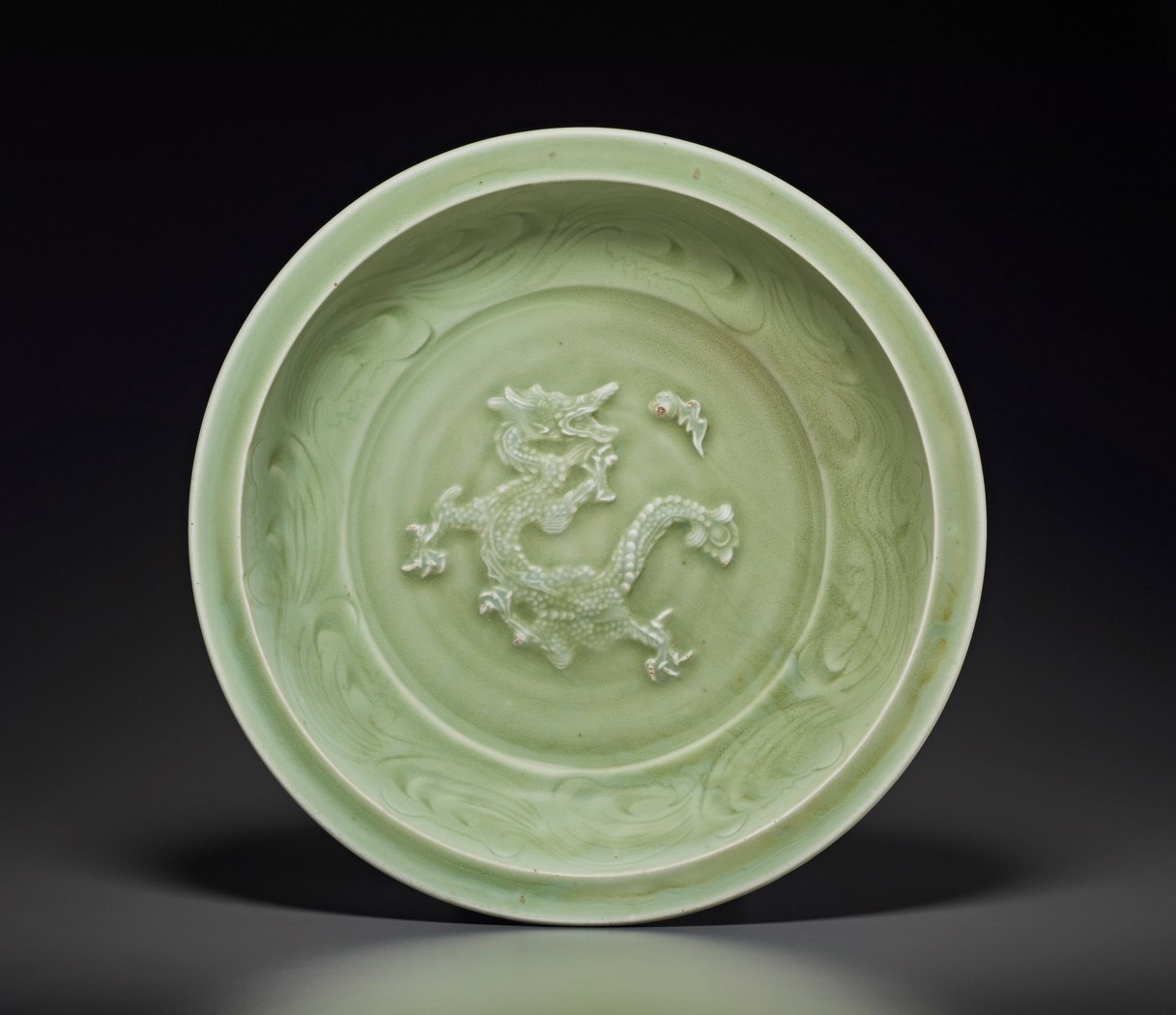 A RARE LARGE MOLDED AND CARVED LONGQUAN CELADON `DRAGON’ DISH , YUAN ...