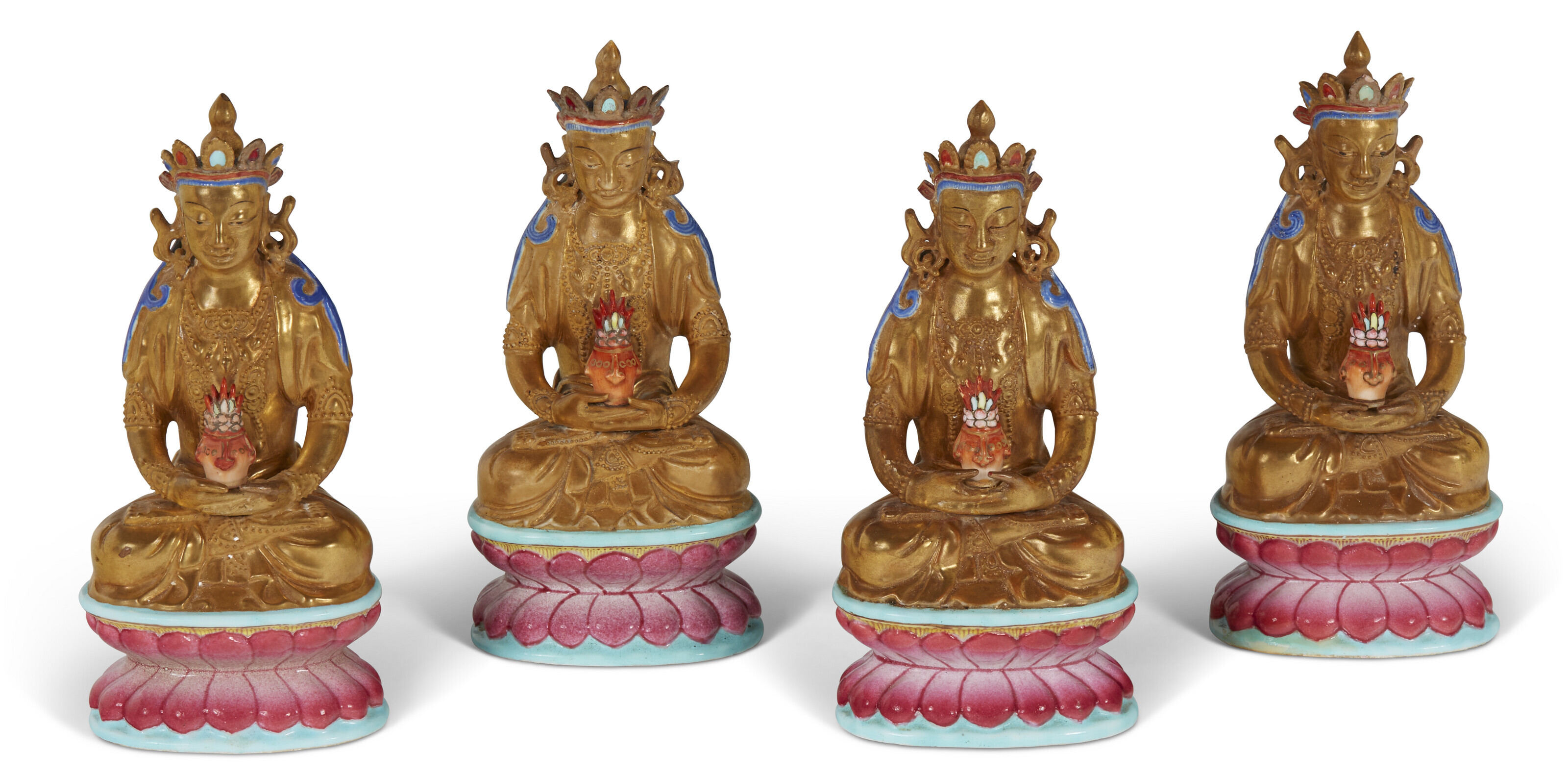 A GROUP OF FOUR CHINESE FAMILLE ROSE FIGURES OF AVALOKITESVARA, QING ...