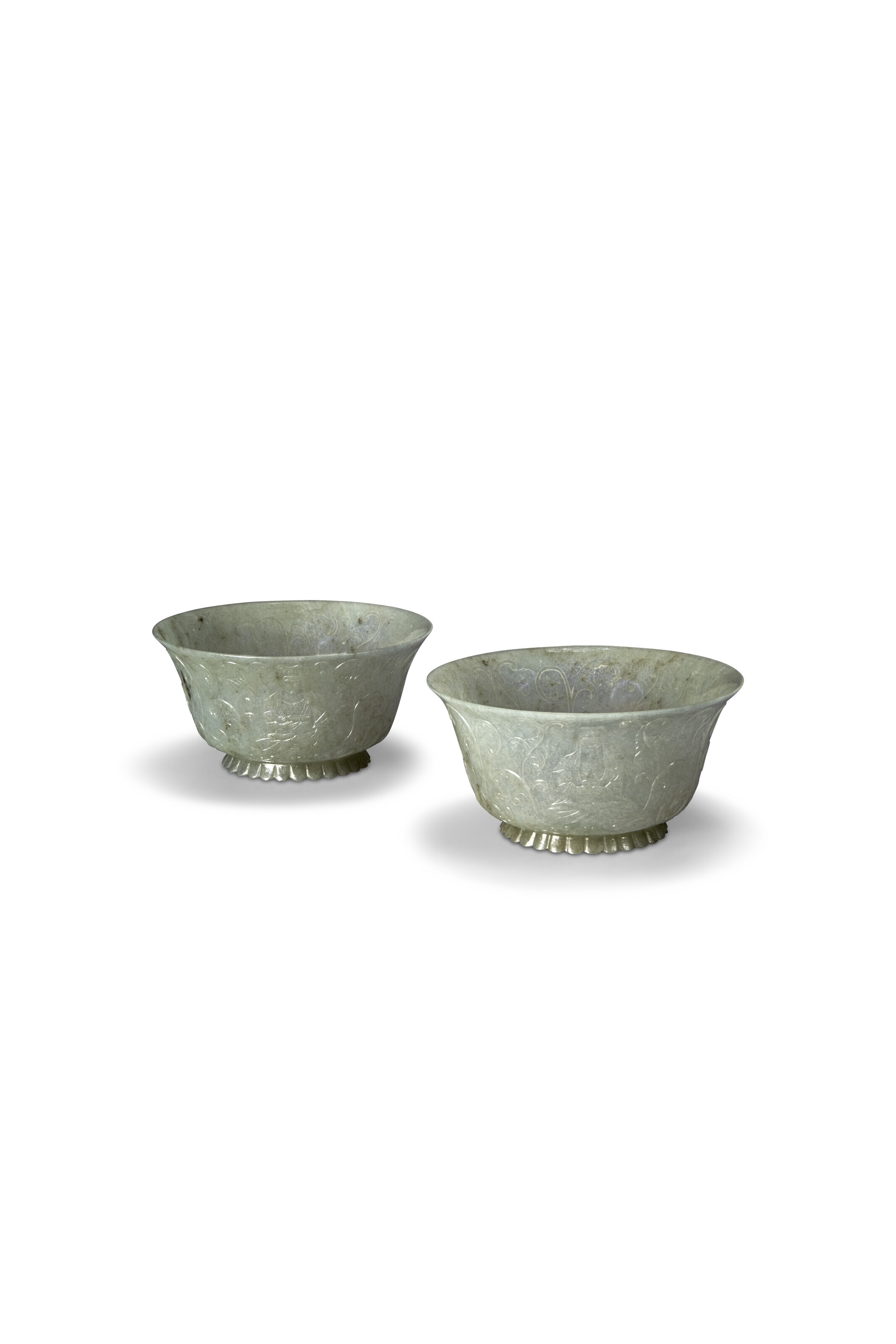 A PAIR OF CHINESE CARVED MUGHAL-STYLE GREENISH-WHITE JADE BOWLS, LATE ...