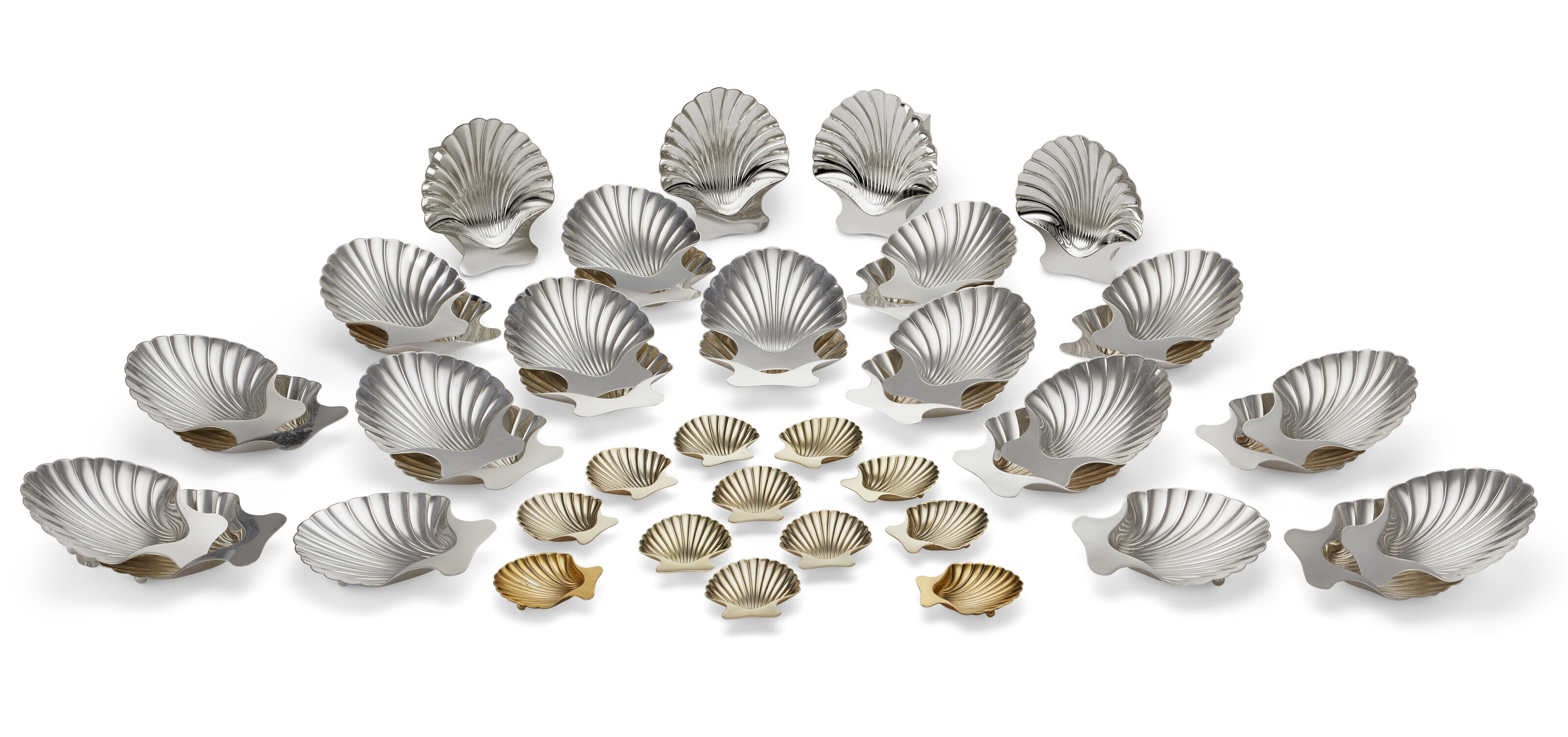 A GROUP OF FORTY-FOUR AMERICAN SILVER AND SILVER-GILT SHELL-FORM DISHES ...