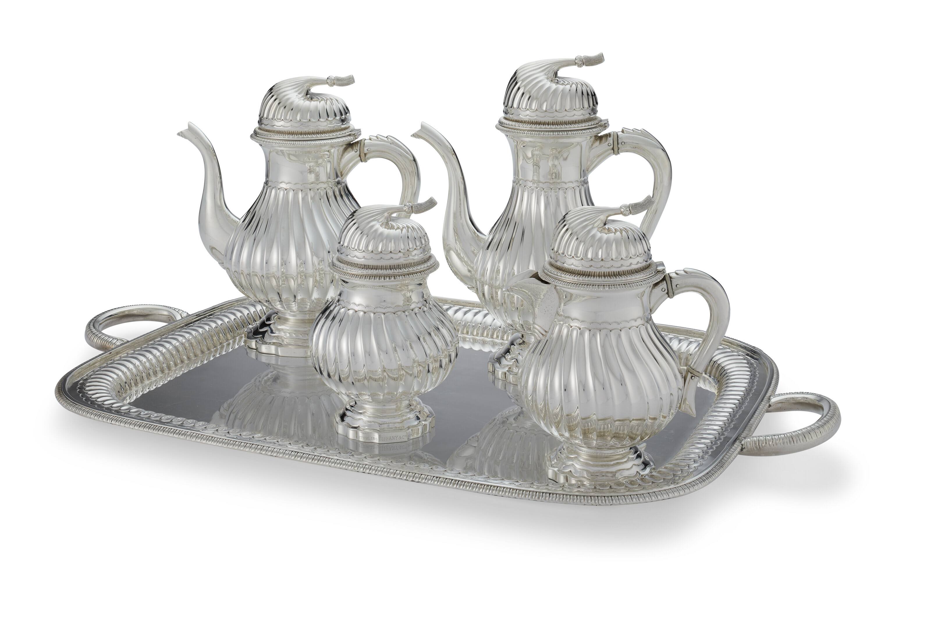 A SILVER FOUR-PIECE TEA AND COFFEE SERVICE AND TWO-HANDLED TRAY, FOR ...