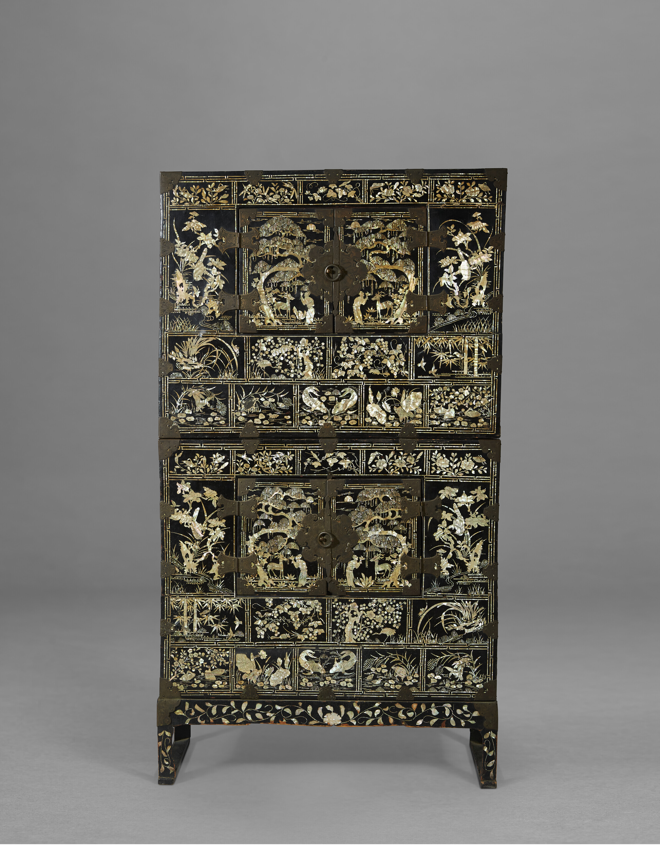 A TWO-TIERED LACQUER AND MOTHER-OF-PEARL CHEST WITH A STAND, JOSEON ...