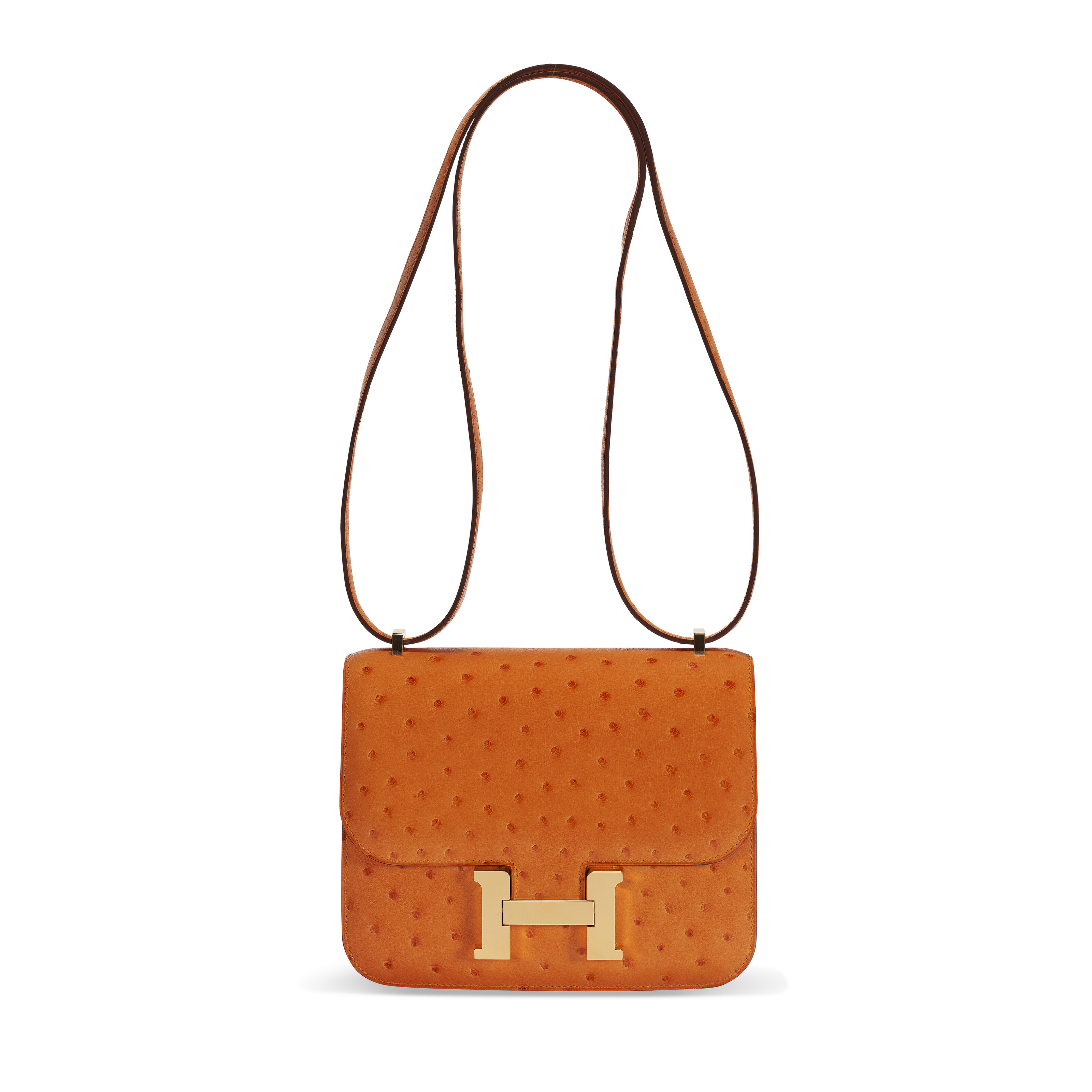 AN ABRICOT OSTRICH MINI CONSTANCE 18 WITH GOLD HARDWARE, HERMÈS, 2019 ...