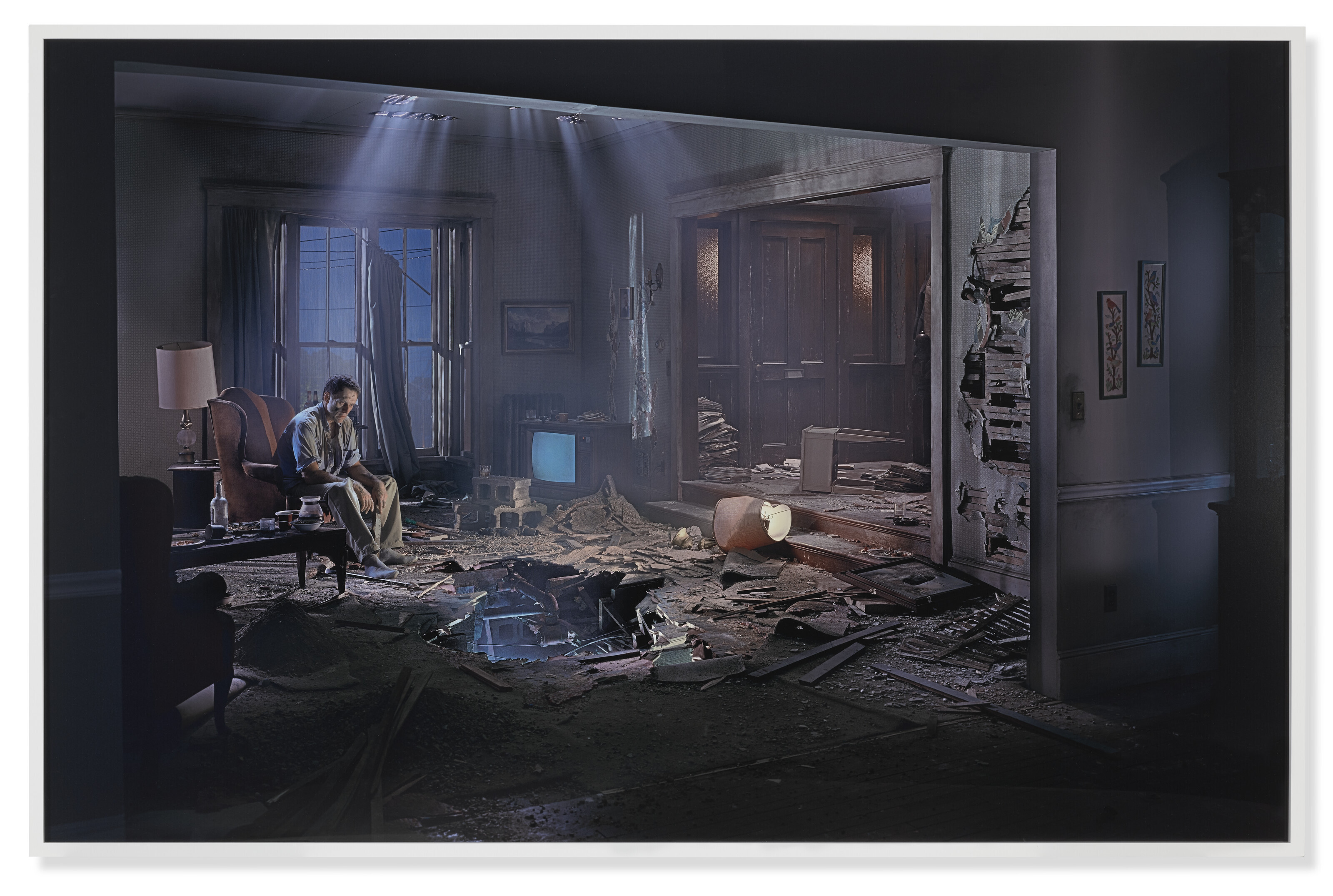 GREGORY CREWDSON (B. 1962), Untitled (man in living room with hole ...