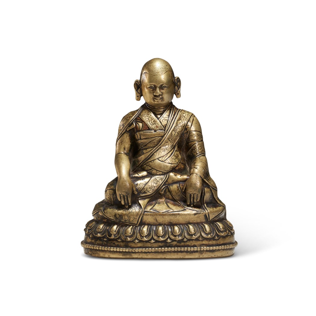 A COPPER AND SILVER-INLAID BRONZE FIGURE OF A LAMA, TIBET, STYLE OF ...