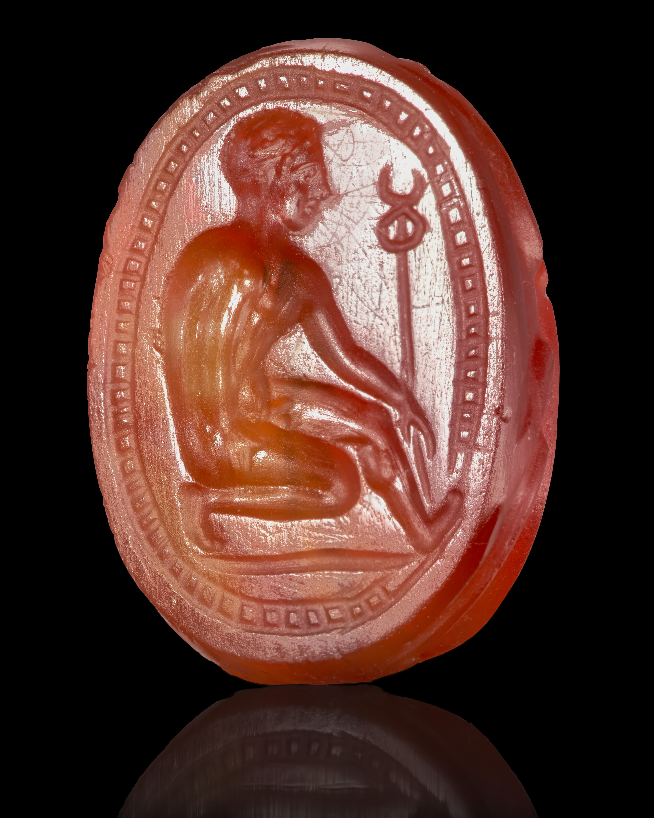 A GREEK CARNELIAN SCARAB WITH HERMES, ARCHAIC PERIOD, CIRCA EARLY 5TH ...