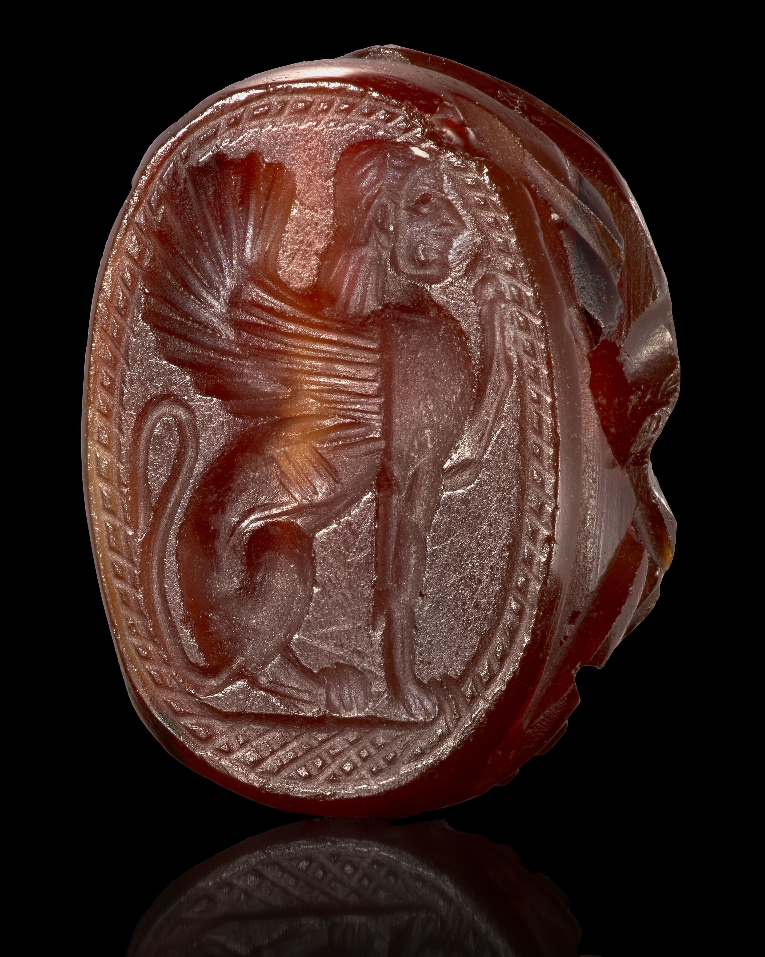 A GREEK CARNELIAN SCARAB WITH A SPHINX, ATTRIBUTED TO THE SPHINX-AND ...