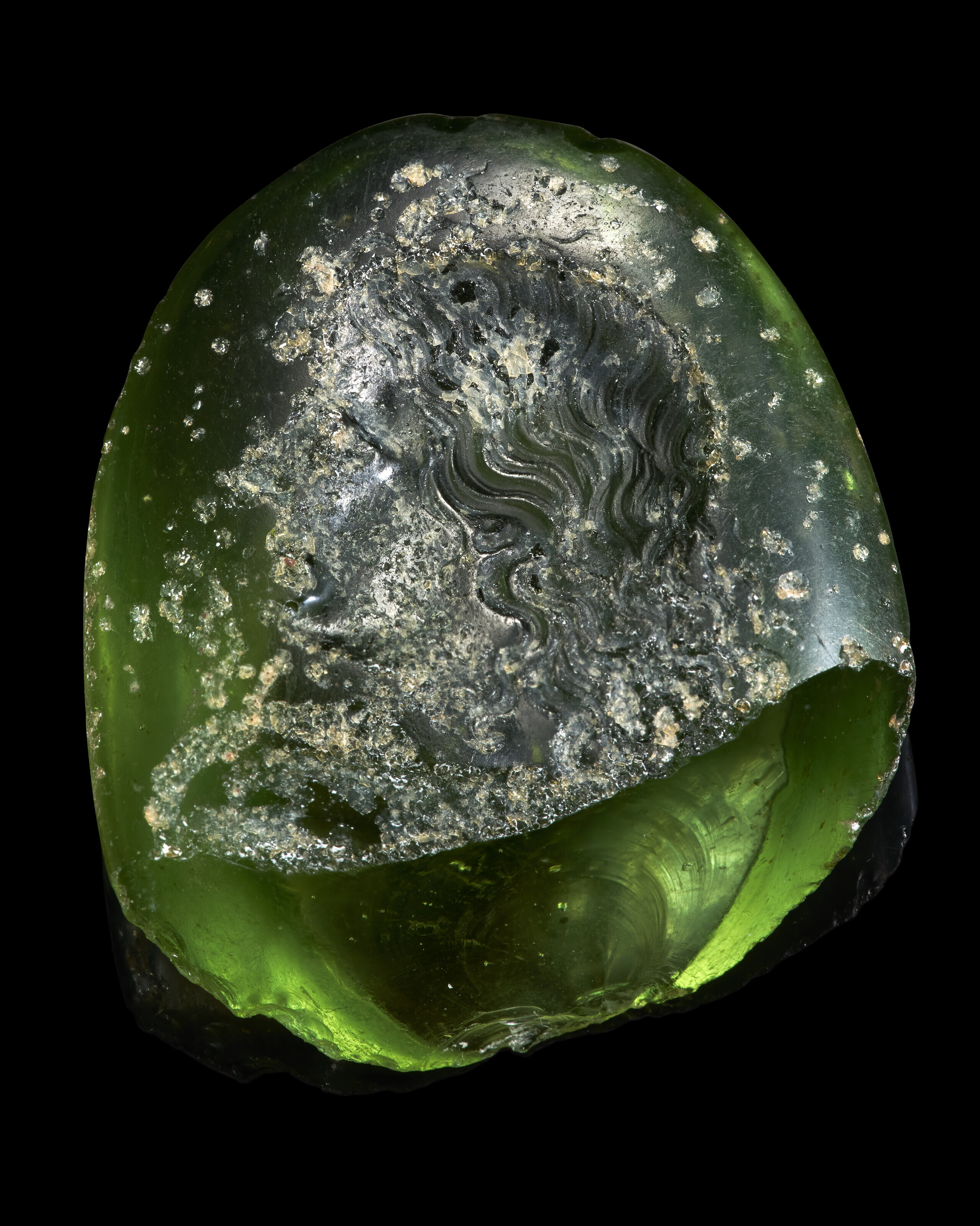 A FRAGMENTARY GREEK GREEN GLASS RINGSTONE WITH A GODDESS, HELLENISTIC ...