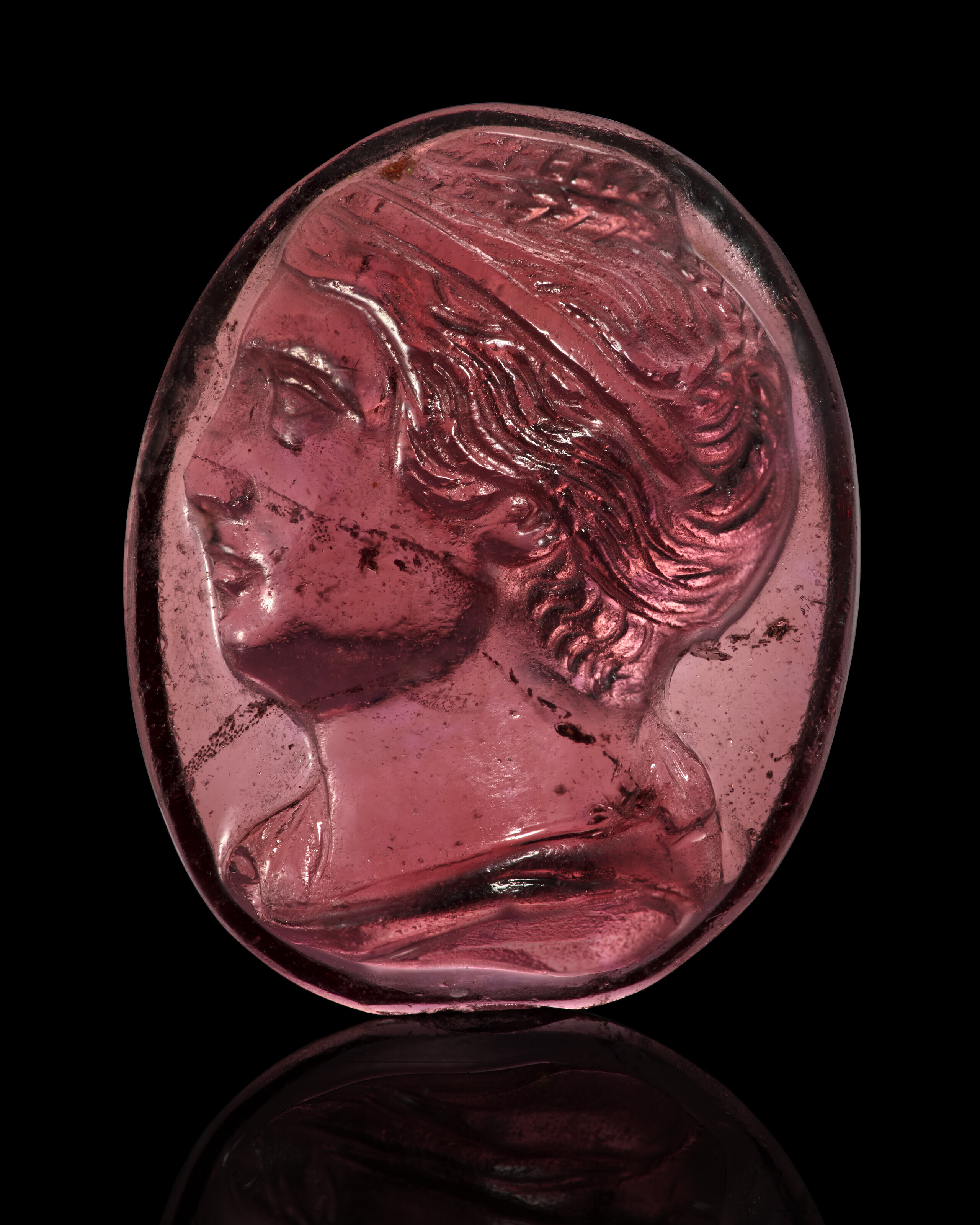 A ROMAN GARNET CAMEO WITH A PORTRAIT OF THE EMPRESS FAUSTINA THE ELDER ...