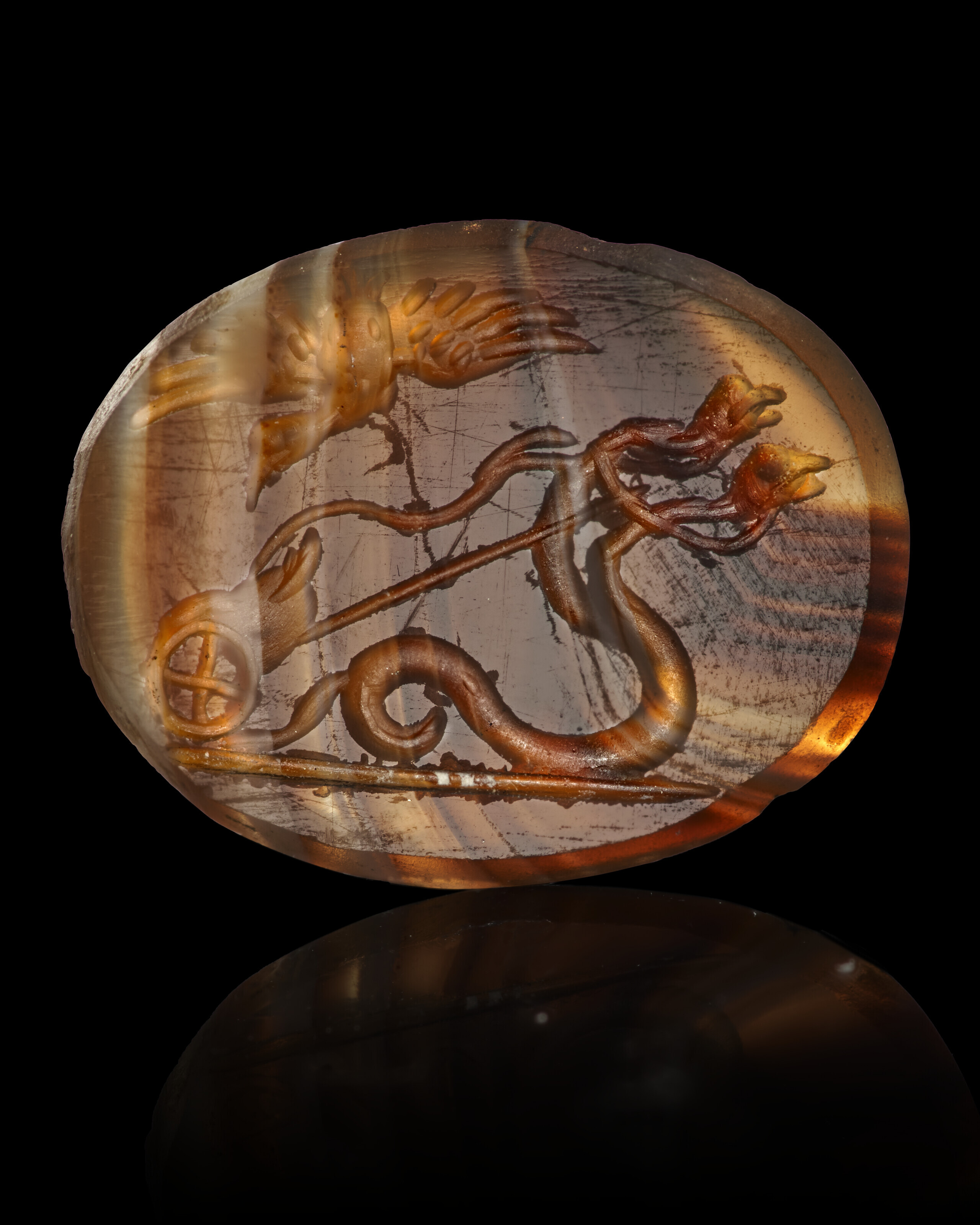 A ROMAN BANDED AGATE RINGSTONE WITH A SNAKE-DRAWN CHARIOT, IMPERIAL ...