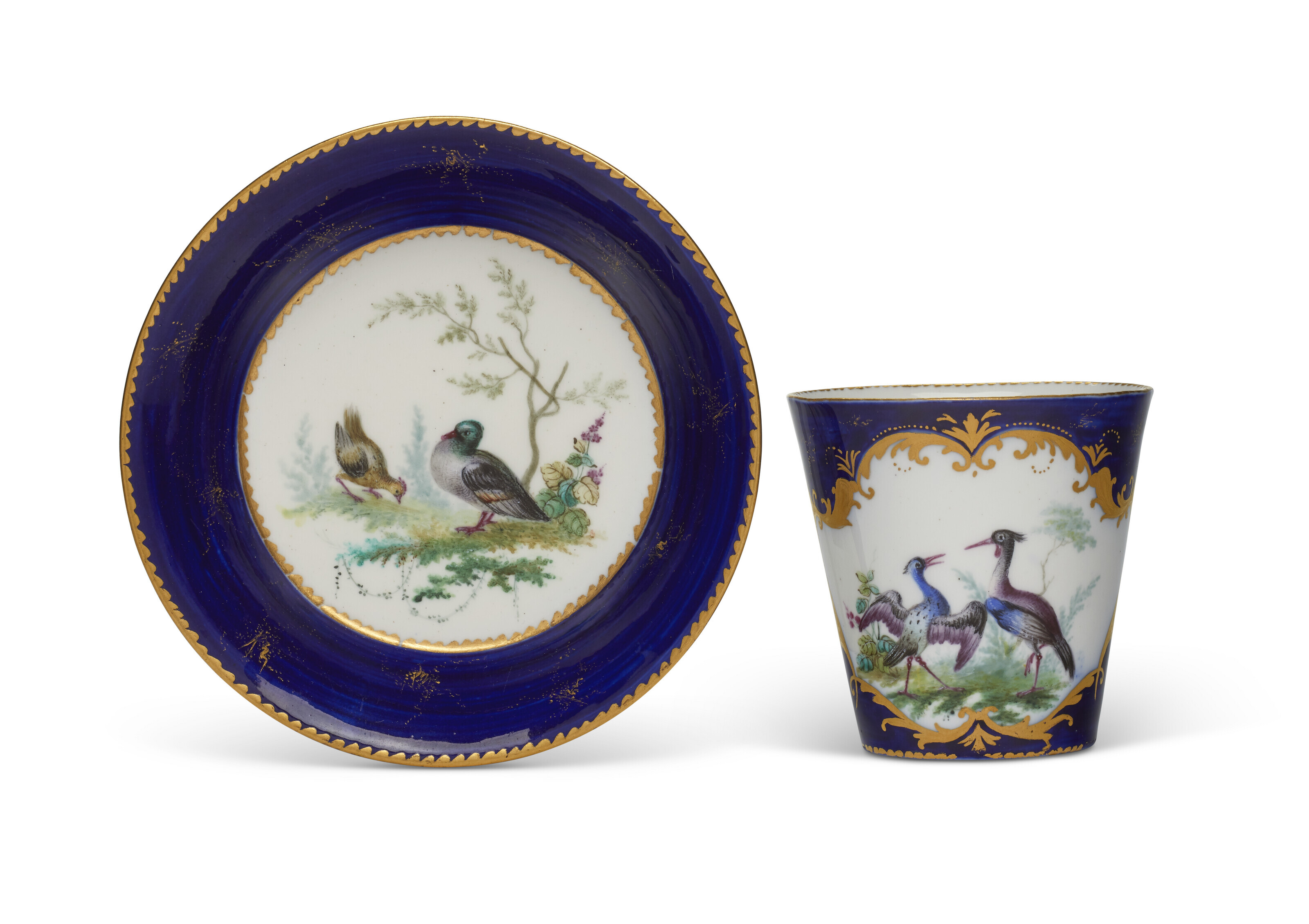 A VINCENNES PORCELAIN 'BLEU LAPIS' CUP AND SAUCER (GOBELET 'A LA REINE ...