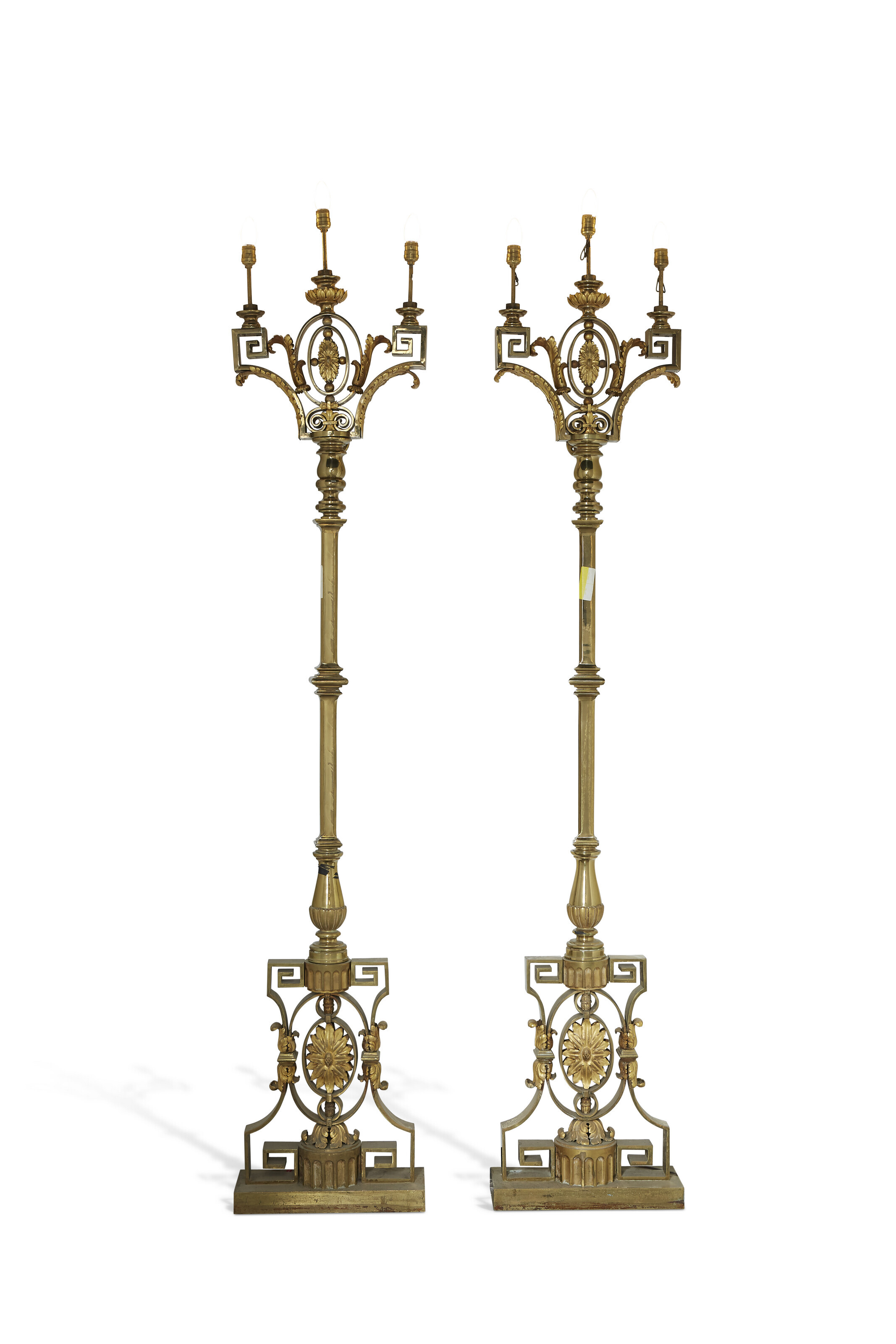 A PAIR OF FRENCH GILT-BRONZE AND POLISHED BRASS THREE-LIGHT TORCHERES ...