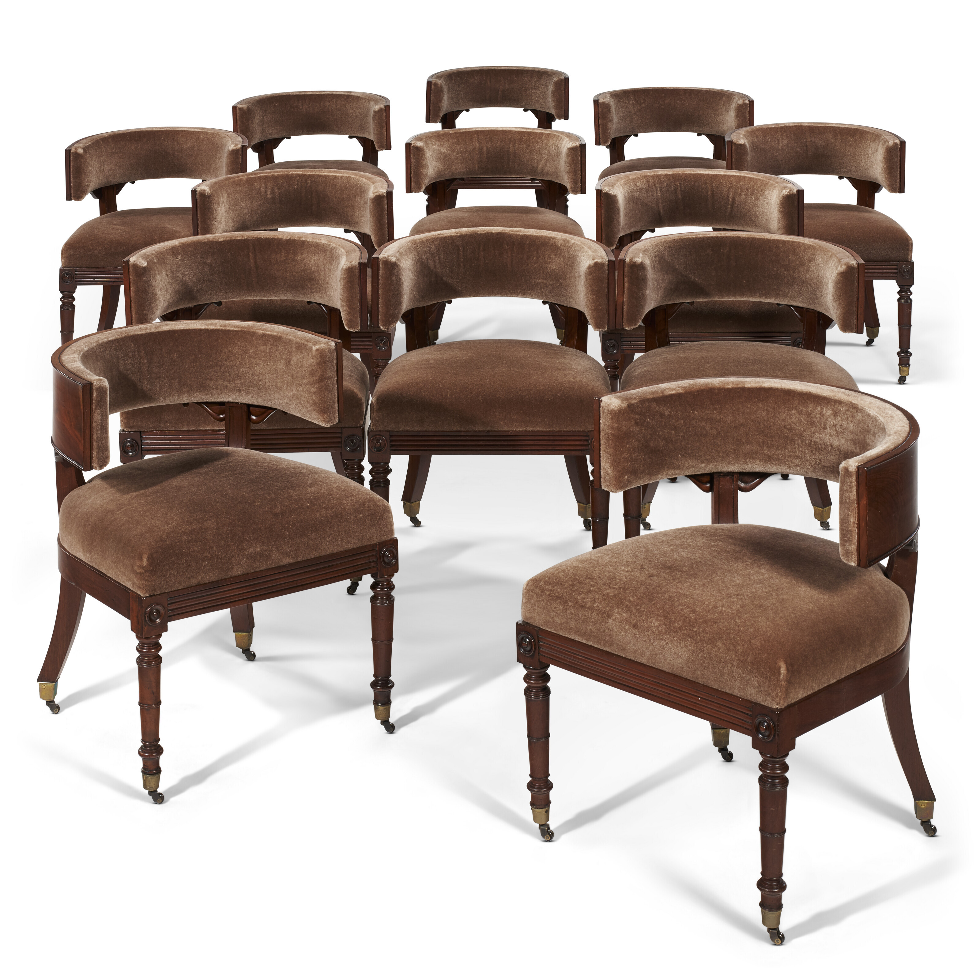 A MATCHED SET OF THIRTEEN REGENCY MAHOGANY DINING CHAIRS, MINOR ...
