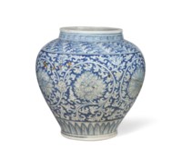 A RARE CHINESE REVERSE-DECORATED BLUE AND WHITE JAR, MING DYNASTY, LATE ...