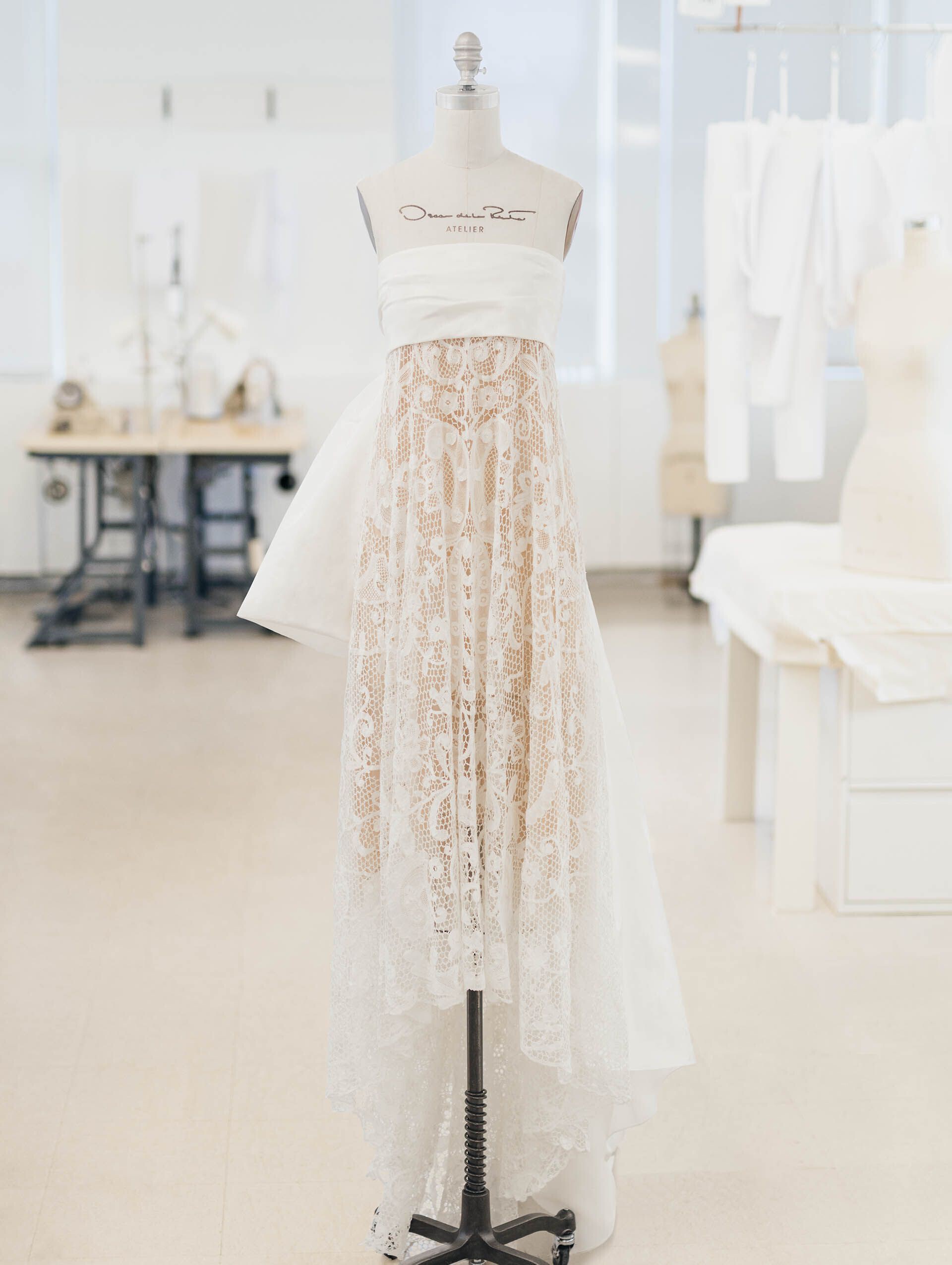 A GROS POINT LACE STRAPLESS GOWN WITH DRAPED BODICE AND BOW, Oscar de ...