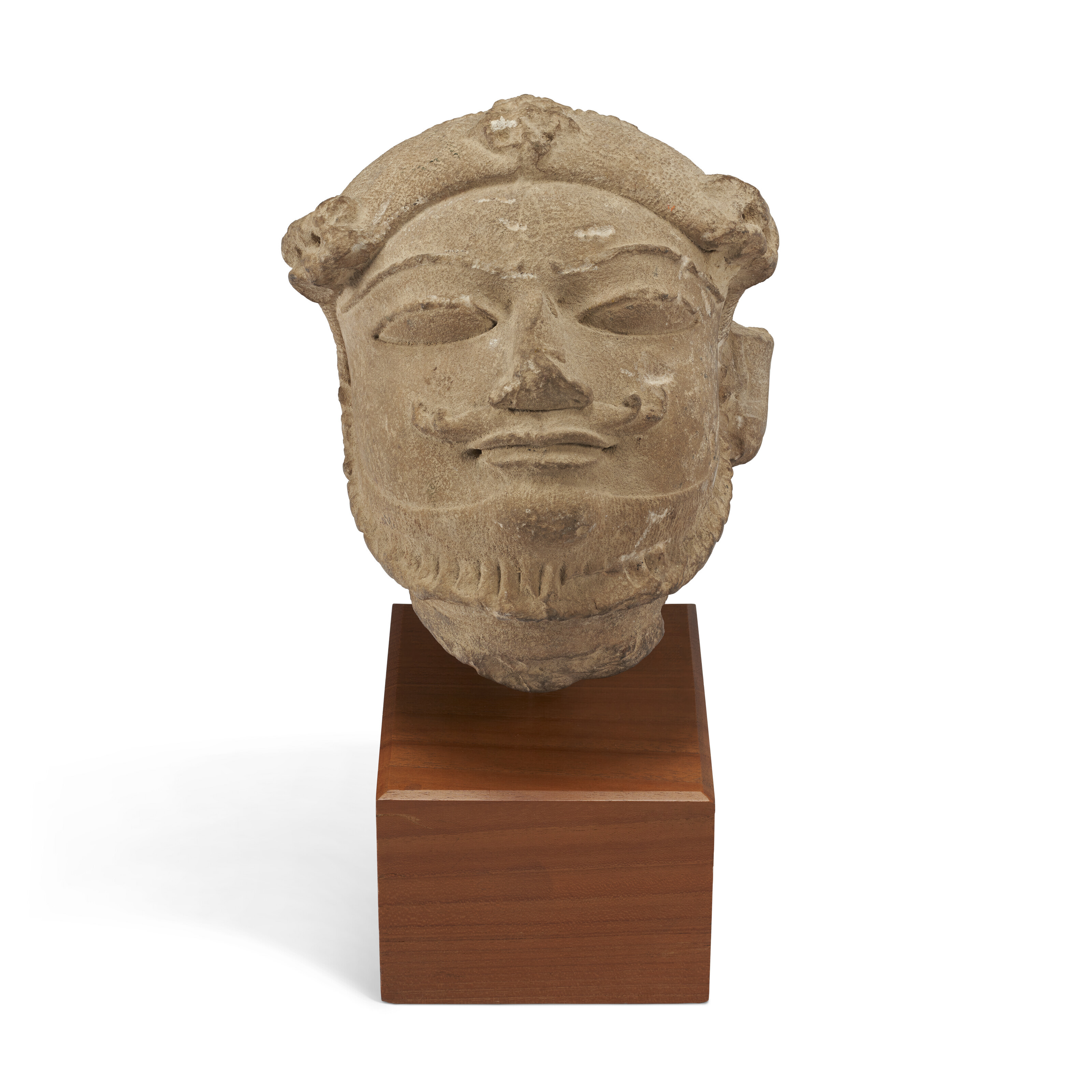 A BUFF SANDSTONE HEAD OF A DEITY, INDIA, RAJASTHAN OR UTTAR PRADESH ...
