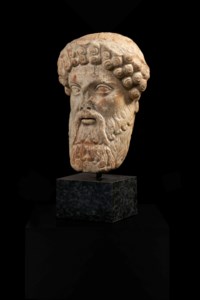 A ROMAN MARBLE HERM HEAD OF HERMES, SEVERAN PERIOD, CIRCA LATE 2ND ...