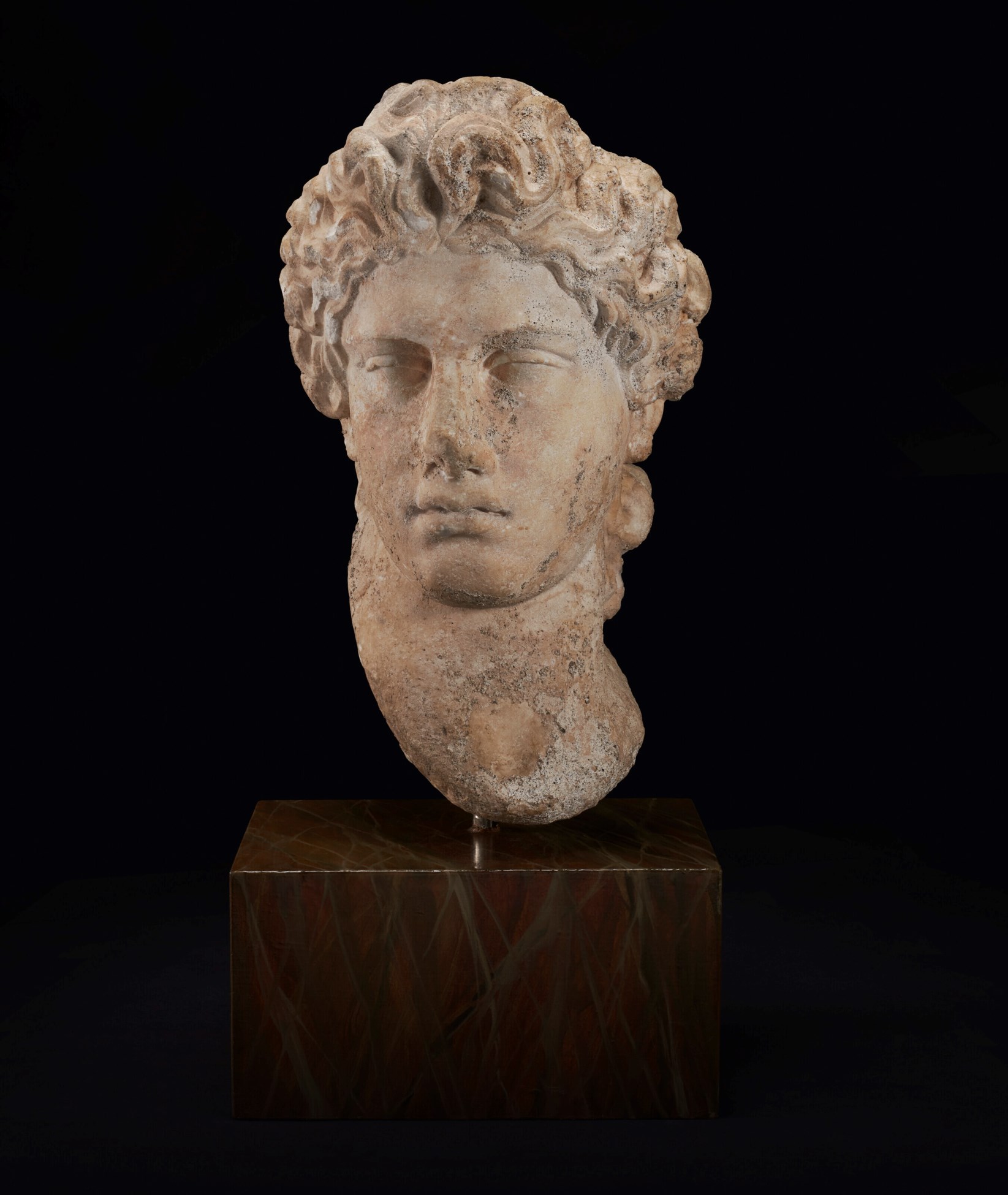 A ROMAN MARBLE HEAD OF APOLLO