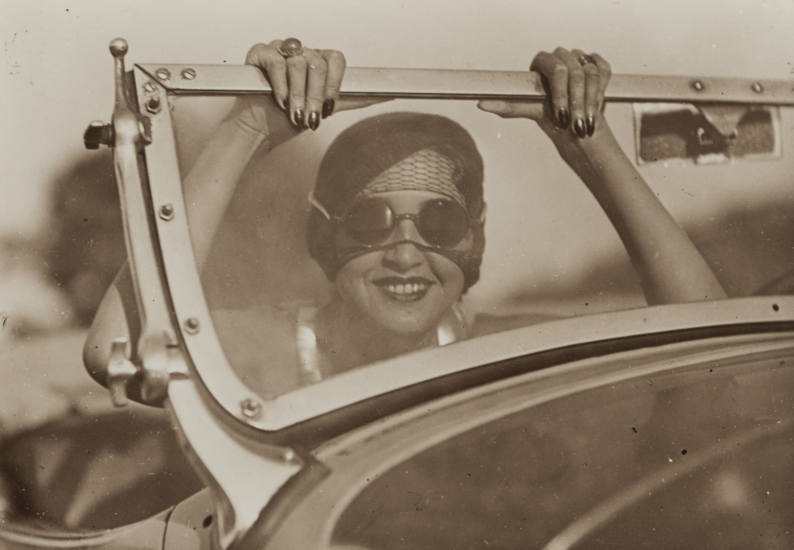 JACQUES HENRI LARTIGUE (1894-1986), Renée Perle with Motoring Goggles ...