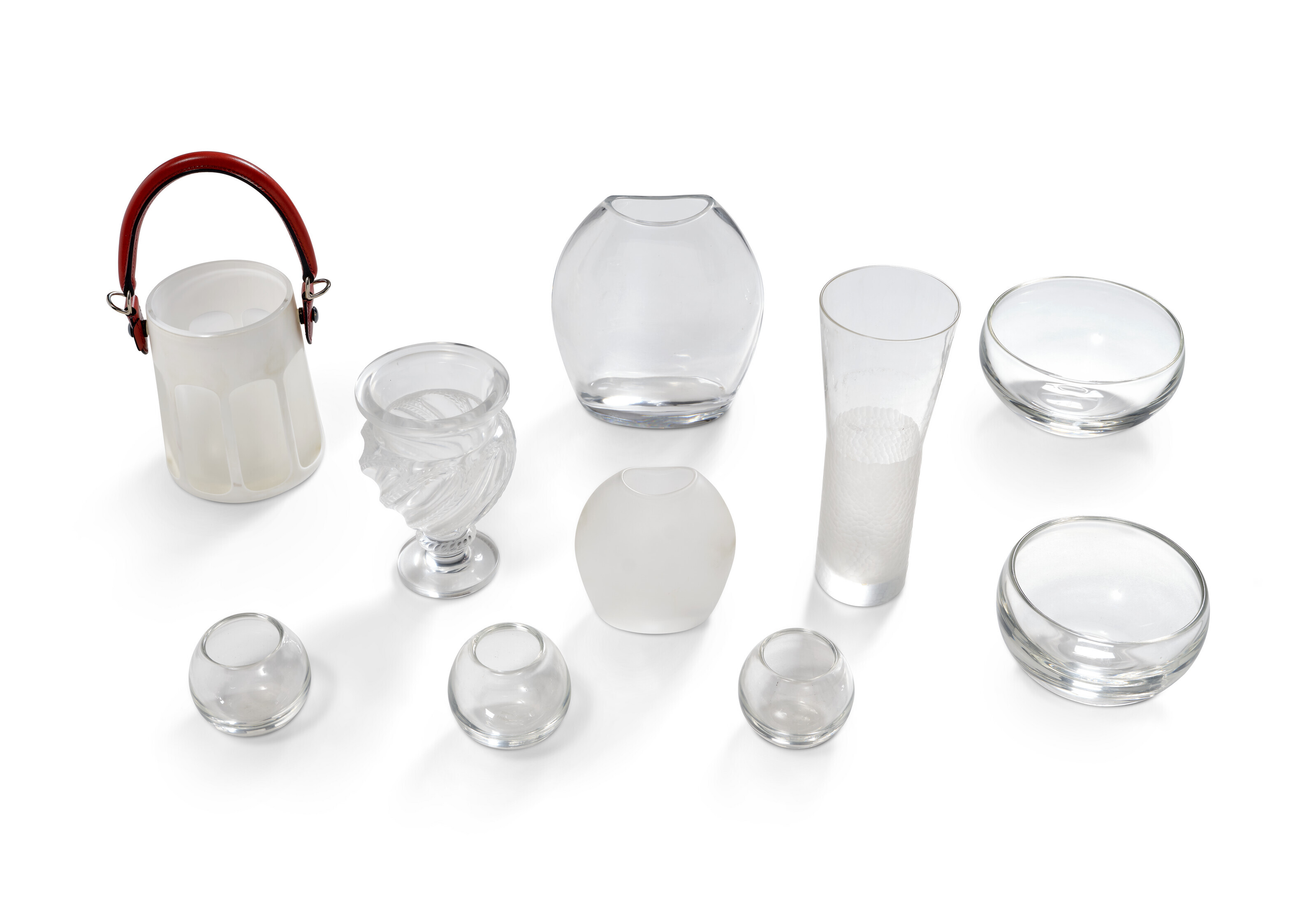A SET OF TEN: FIVE GLASSES & FIVE GLASS VASES, HERMÈS | Christie’s